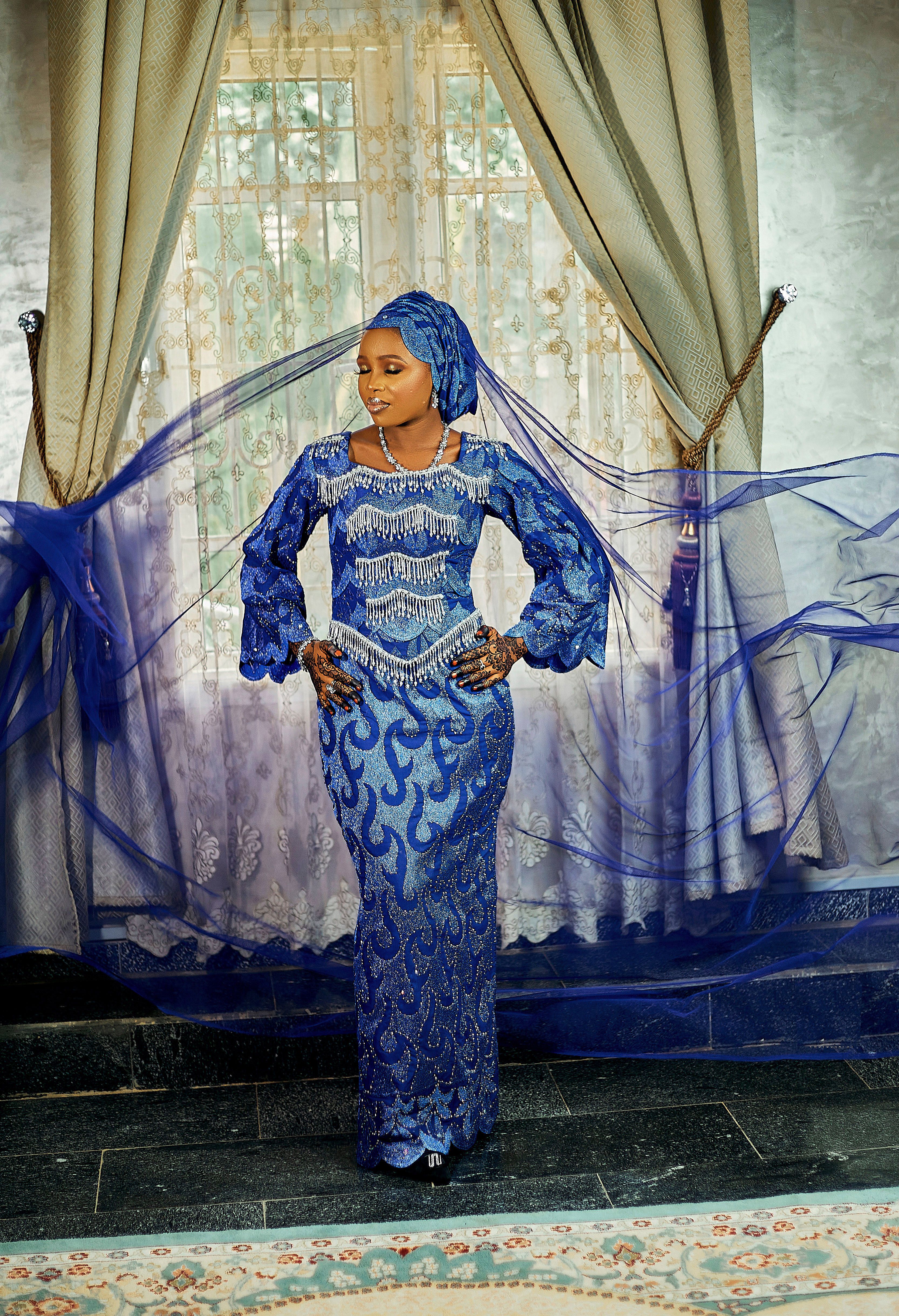 Elegant Woman in Traditional Blue Dress Indoors · Free Stock Photo