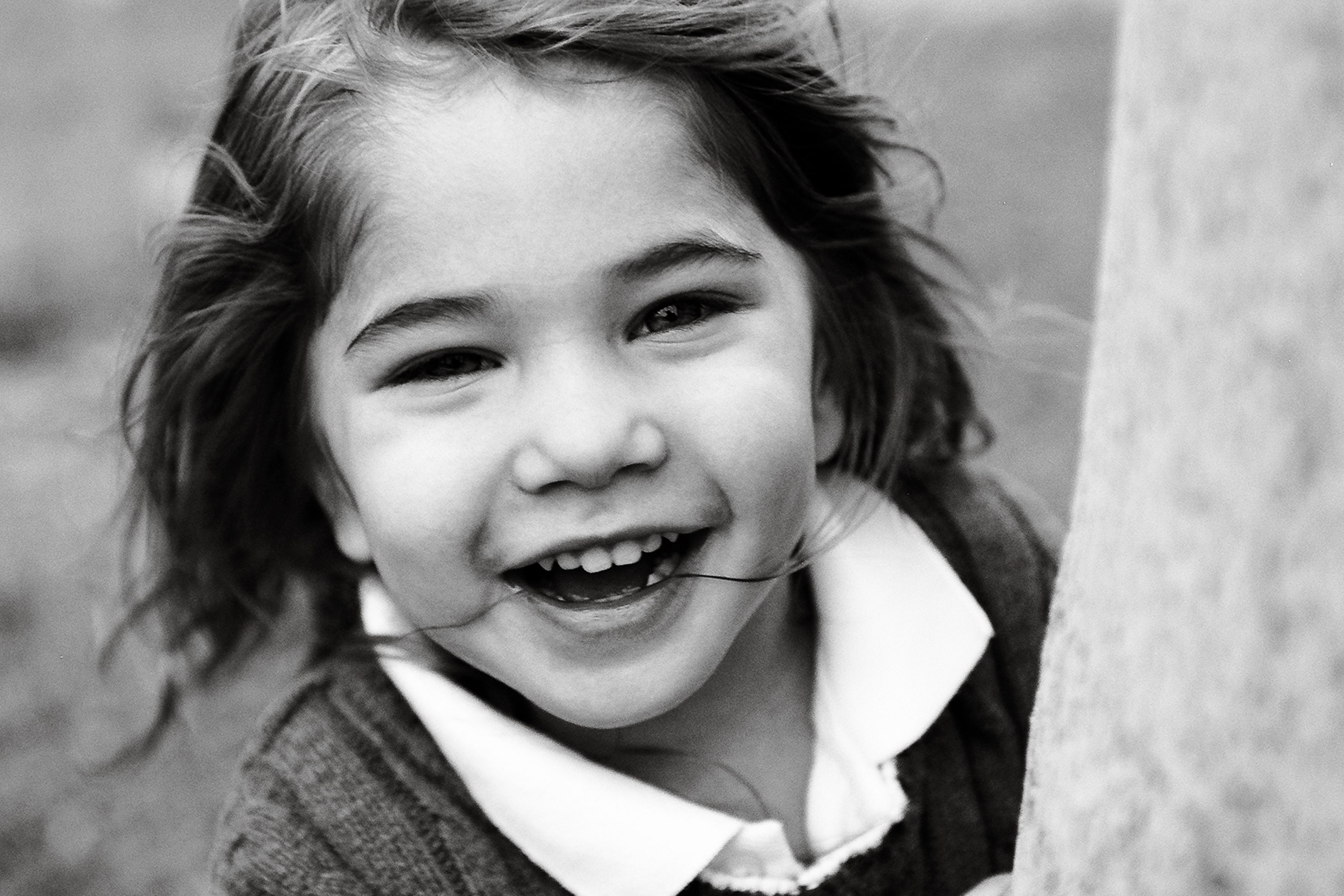 Joyful Child's Portrait in Black and White · Free Stock Photo