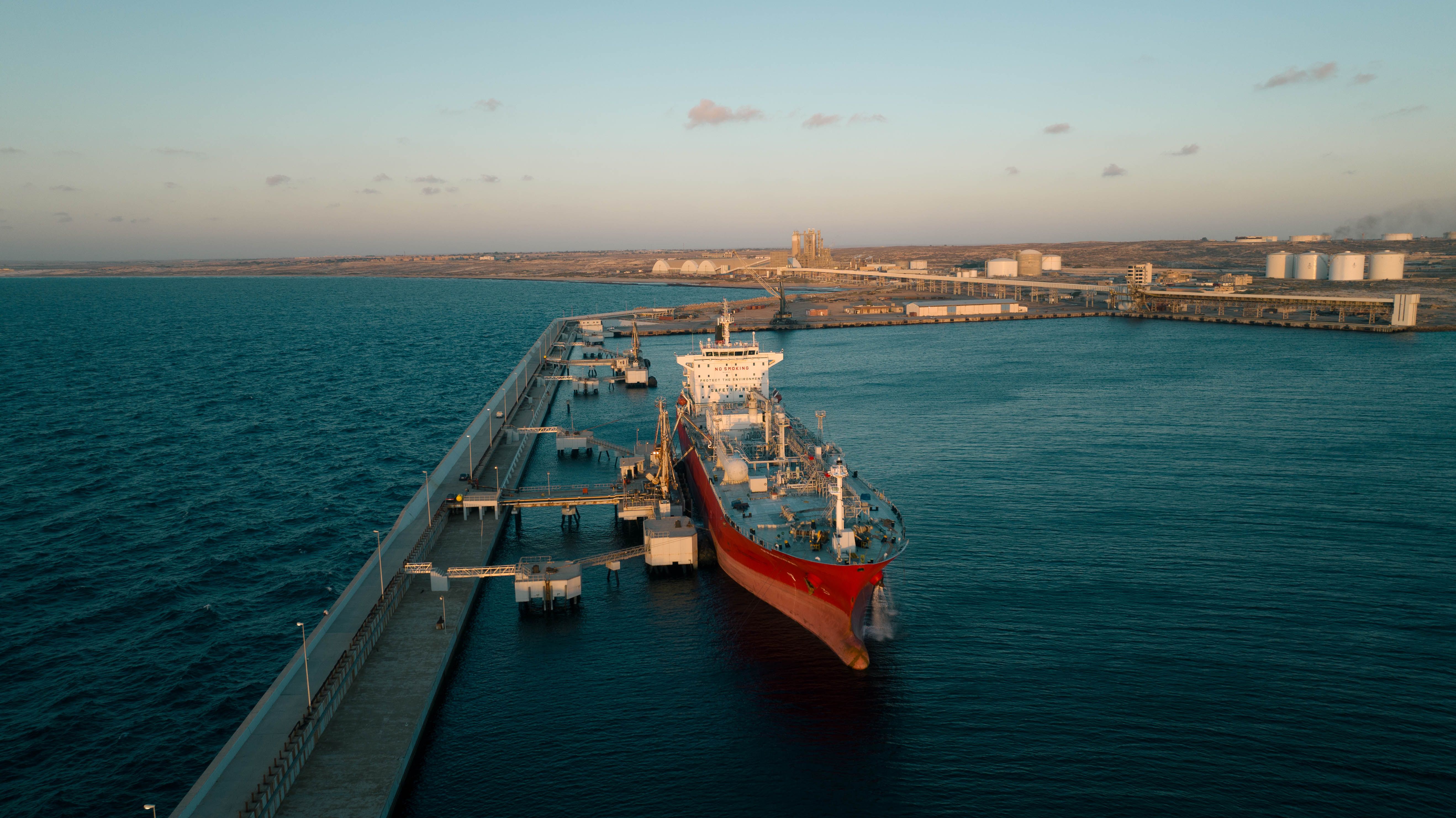 Aerial View of Docked Cargo Ship at Sunset · Free Stock Photo