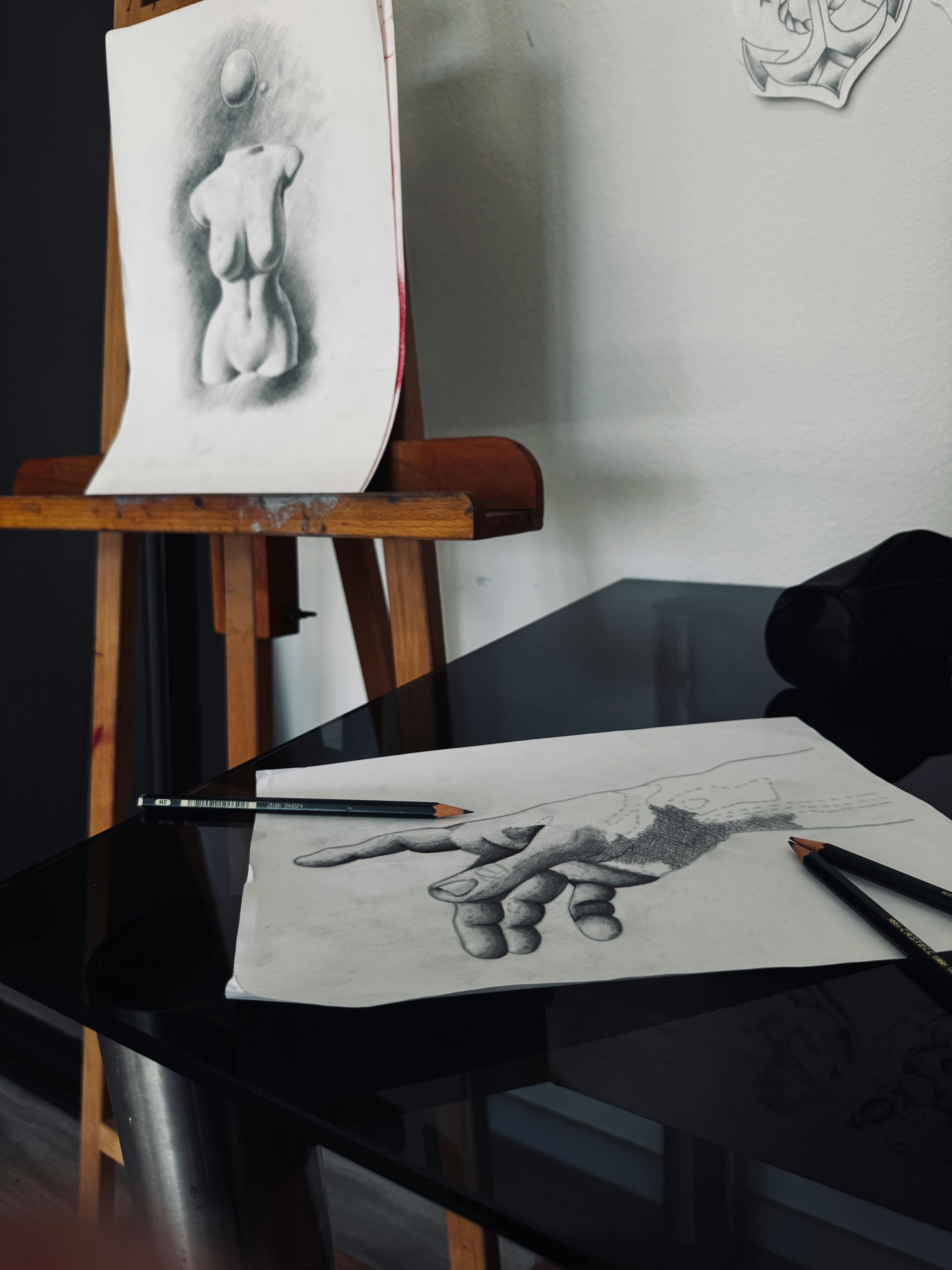 Art Studio Sketch with Easel and Pencil Drawings · Free Stock Photo