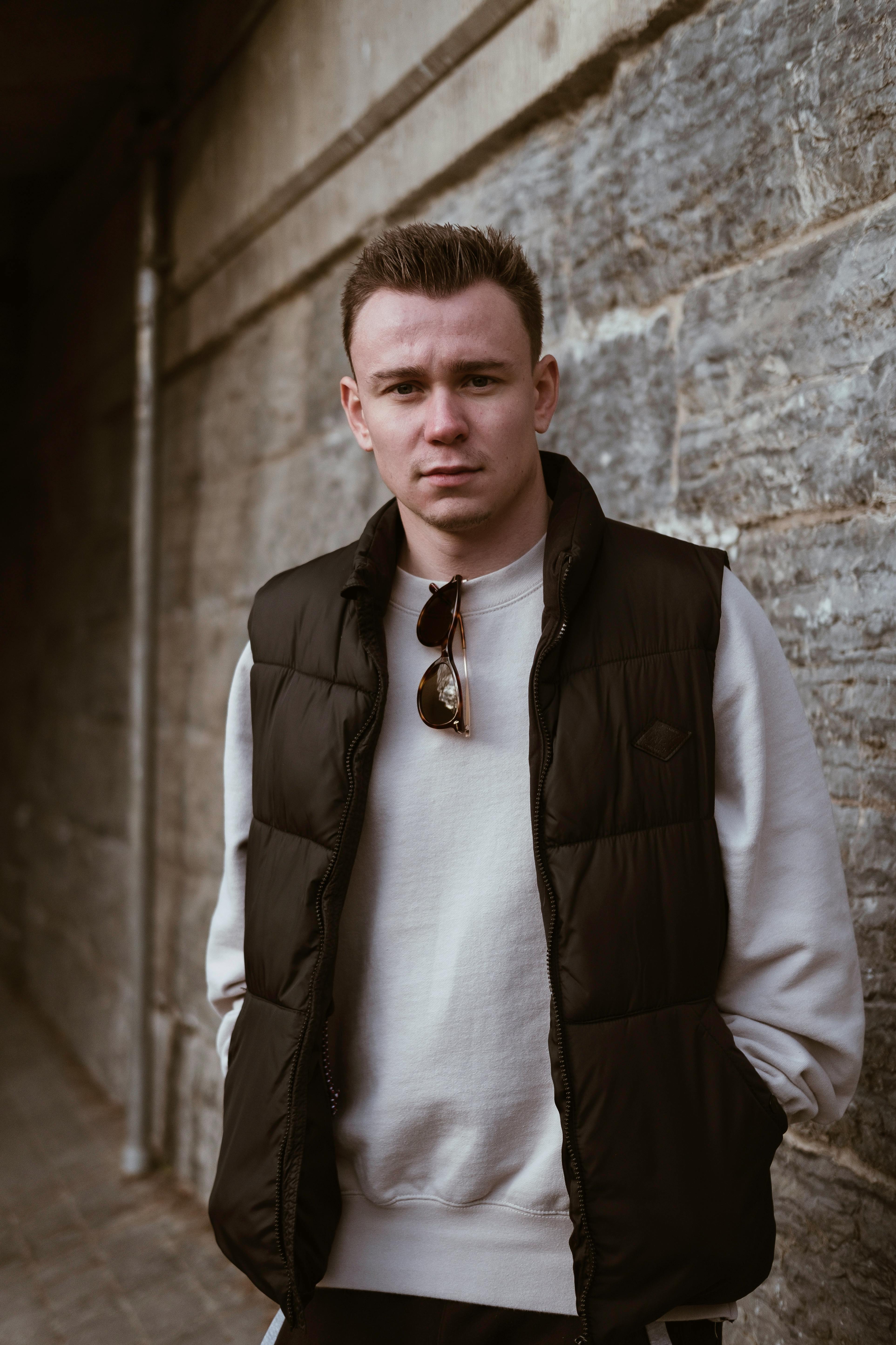 Photo of Man Standing Near Buildings · Free Stock Photo