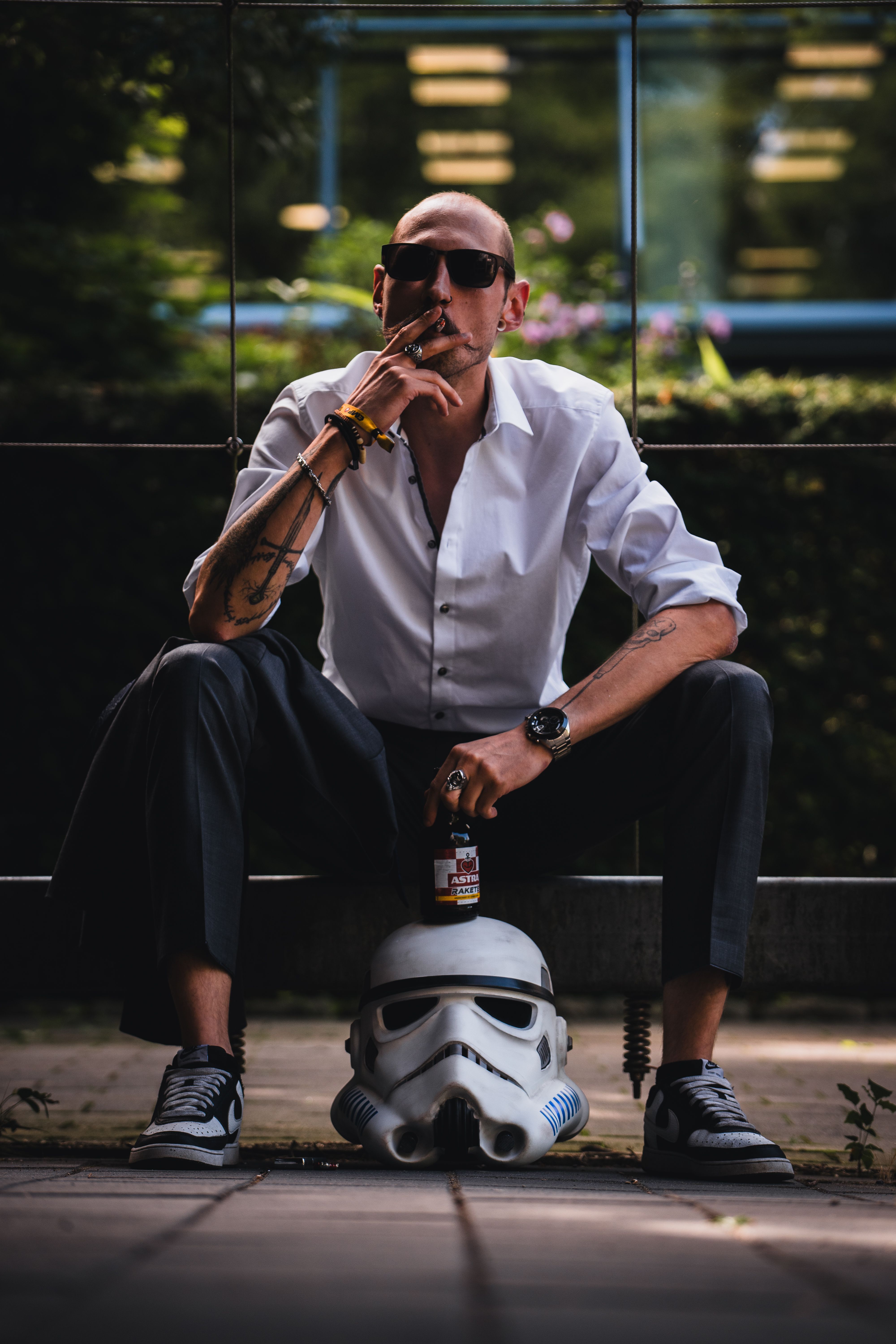Stylish Young Man with Stormtrooper Helmet Outdoors · Free Stock Photo