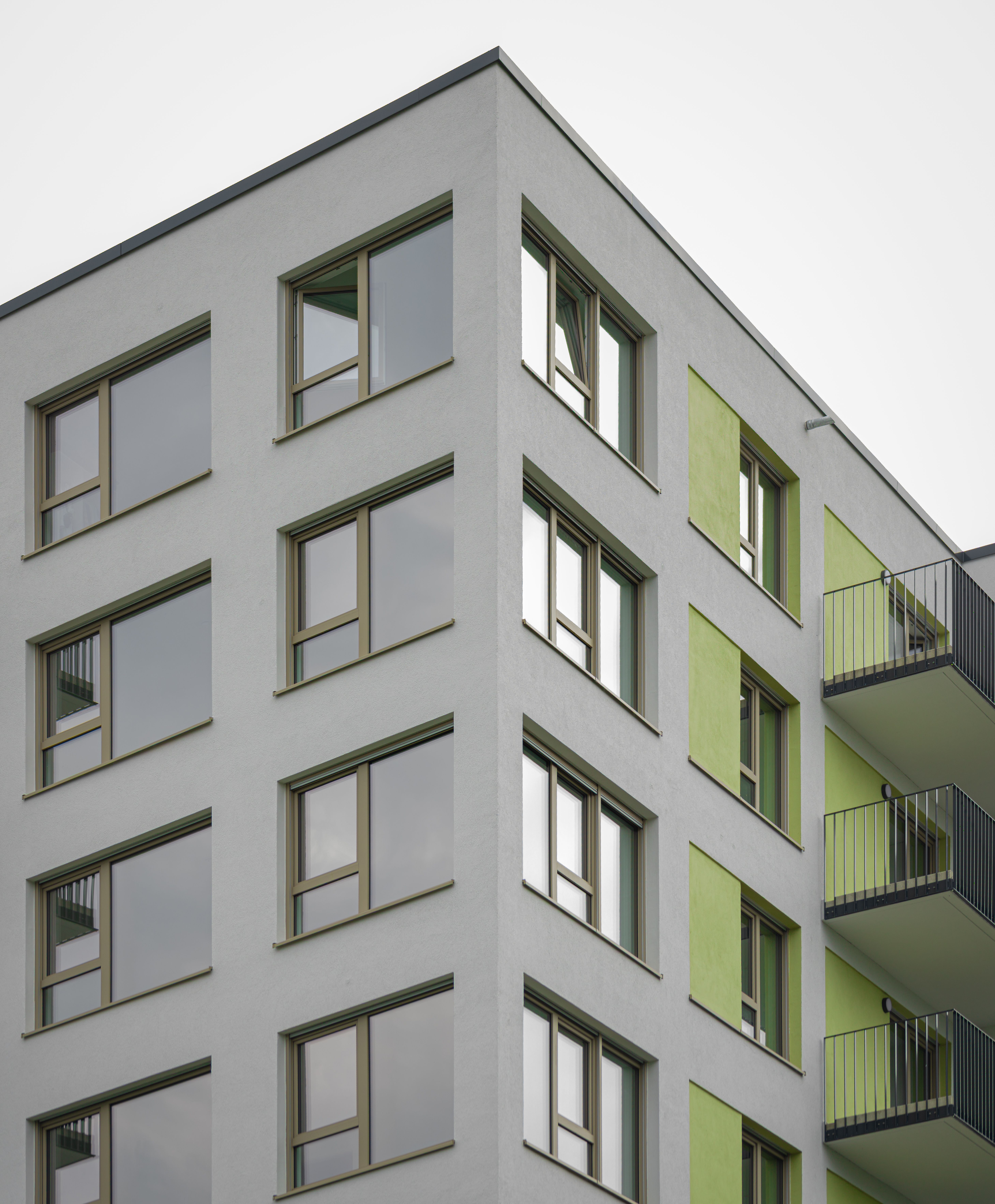 Modern Apartment Building with Green Accents · Free Stock Photo