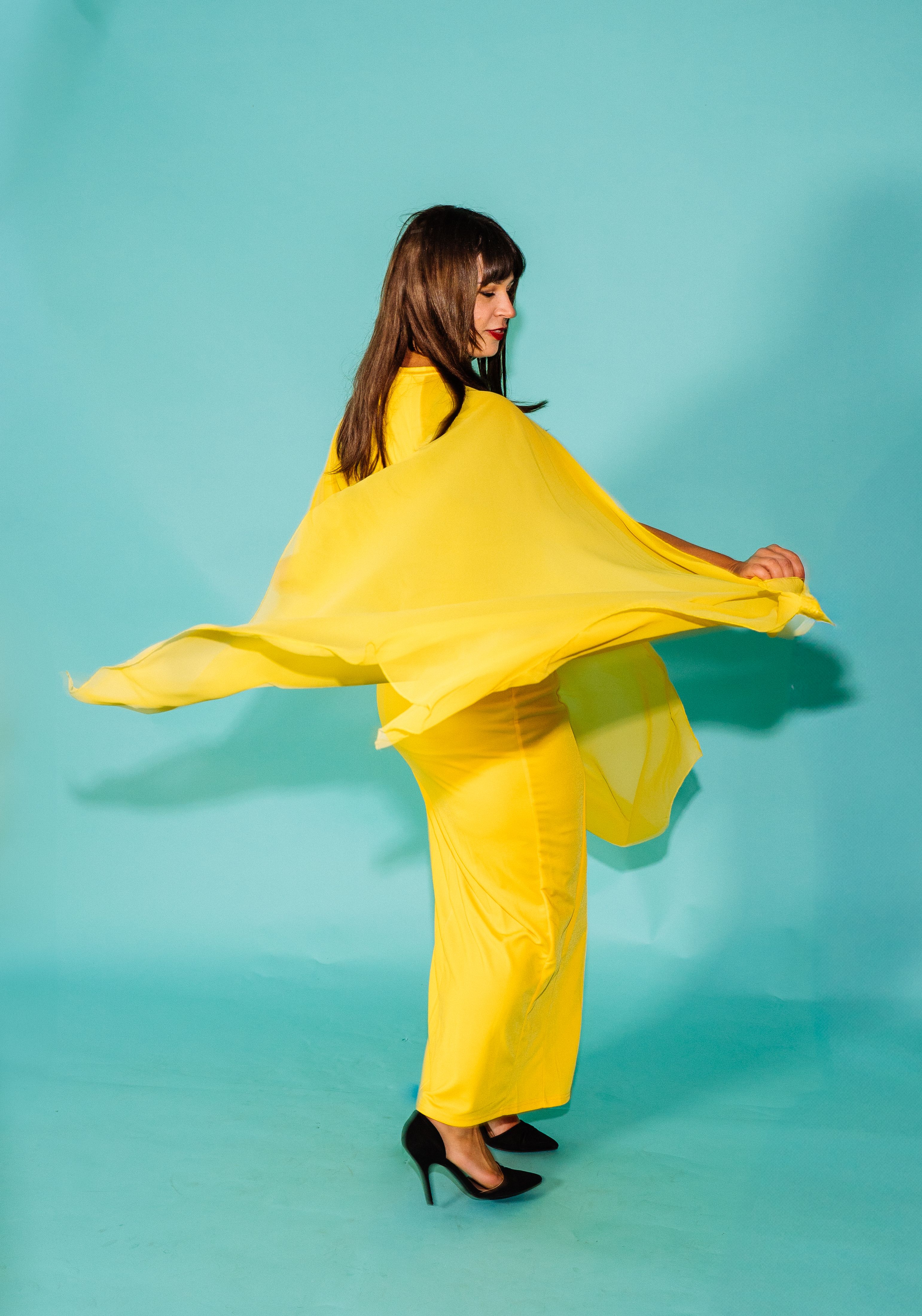 Woman in Yellow Dress Spinning Gracefully · Free Stock Photo