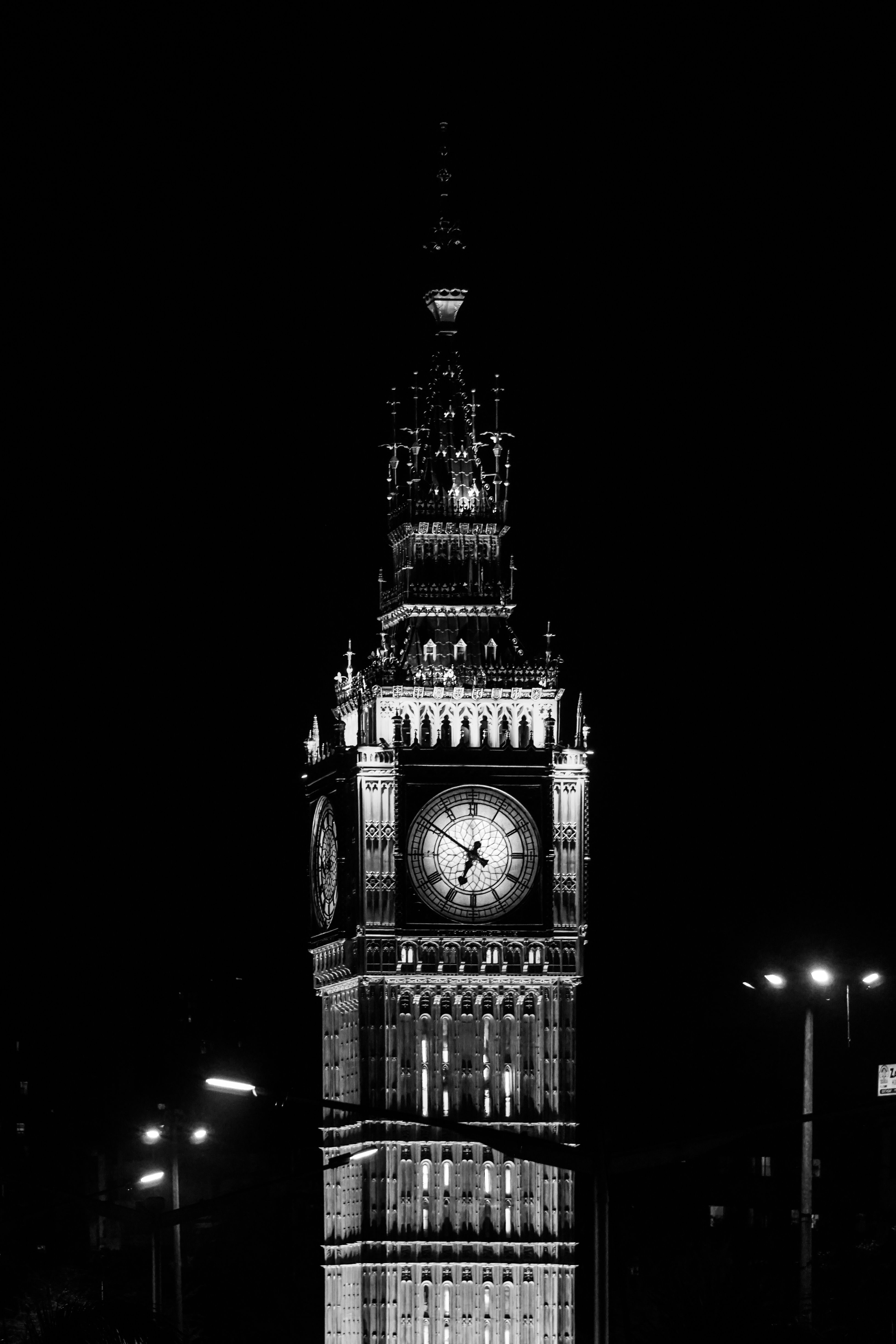 Iconic Clock Tower Illuminated at Night · Free Stock Photo