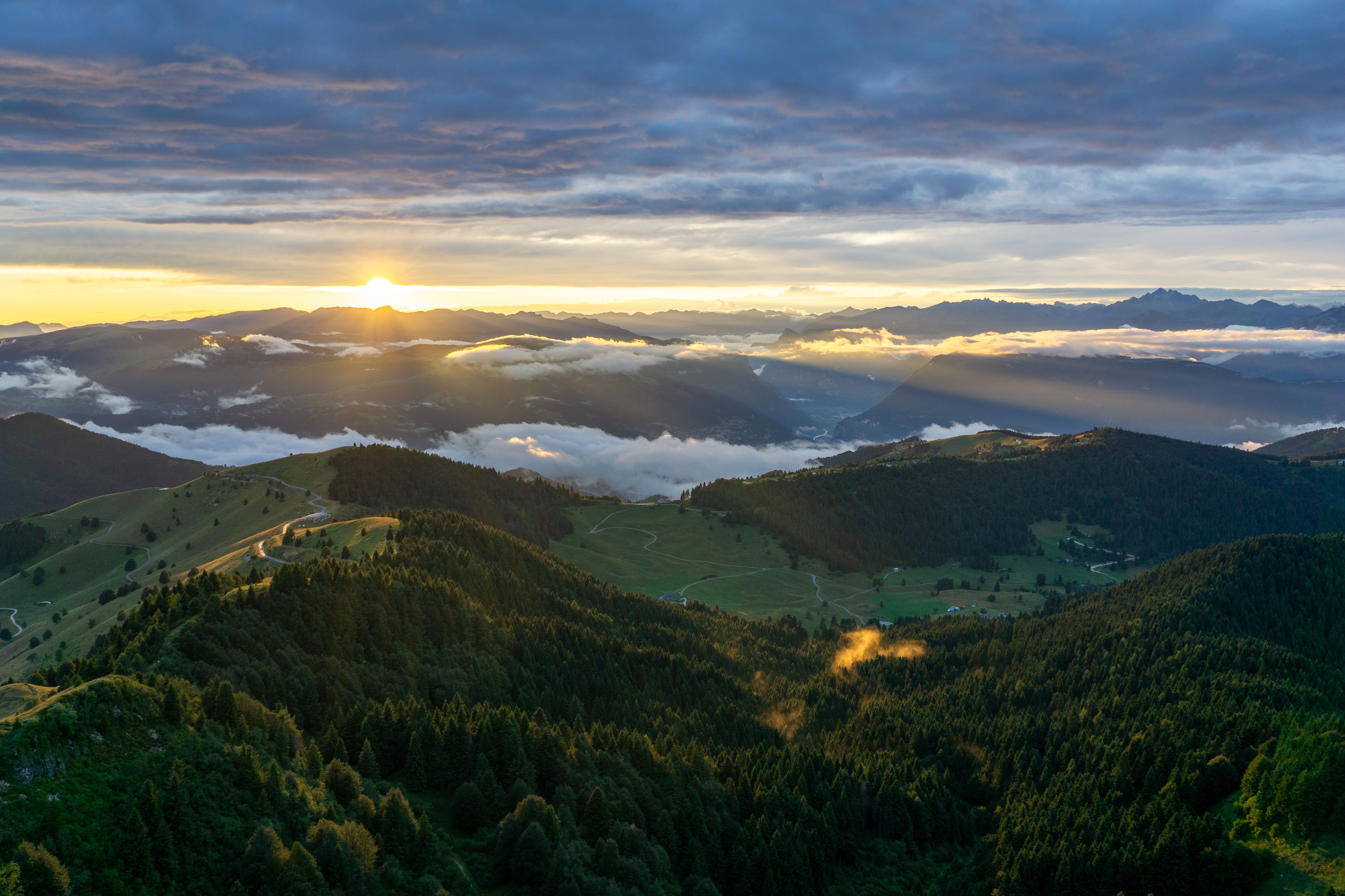 Sunrise Over Monte Grappa's Lush Green Landscapes · Free Stock Photo