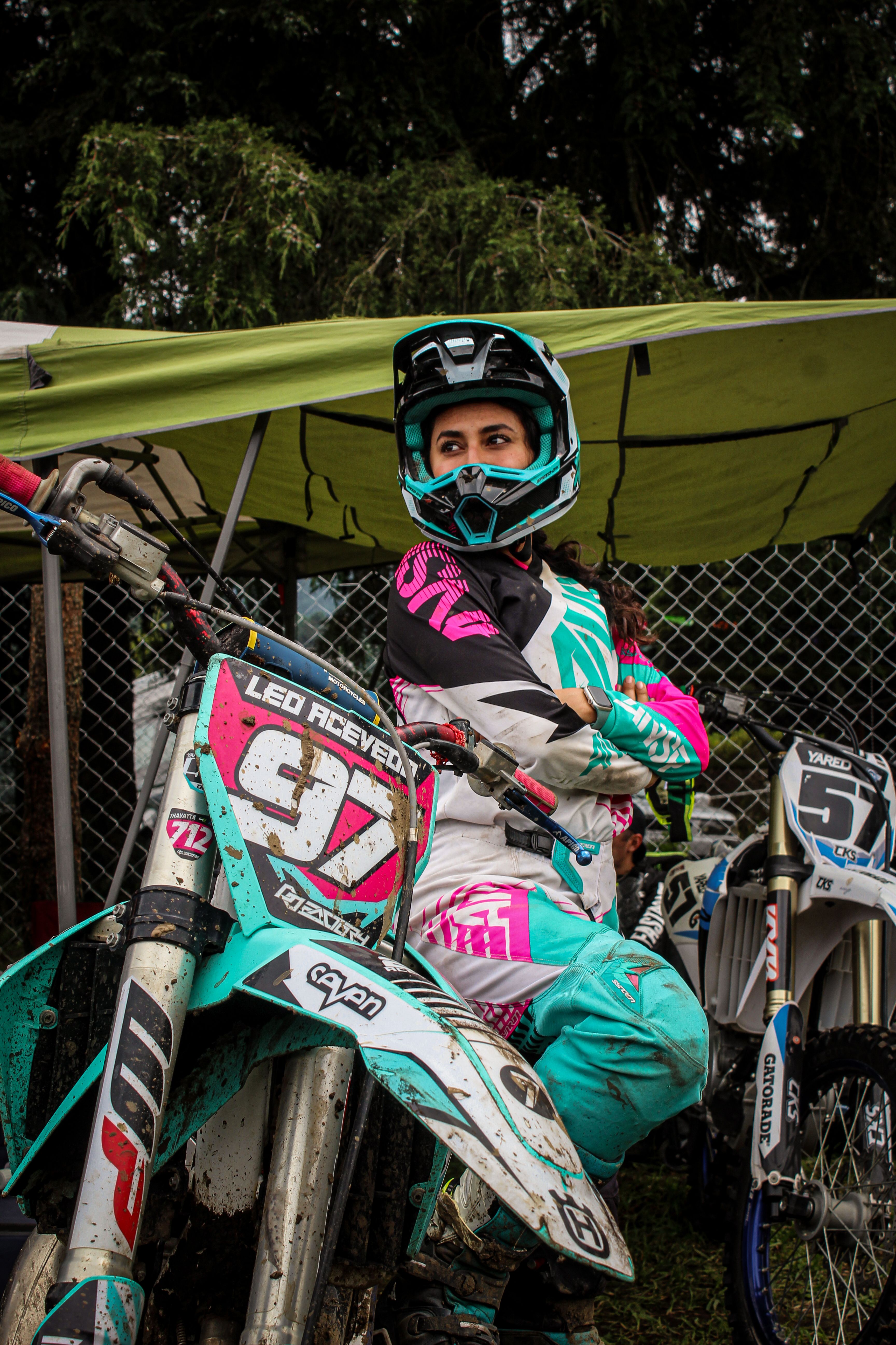 Female Motocross Rider Resting with Dirt Bike · Free Stock Photo