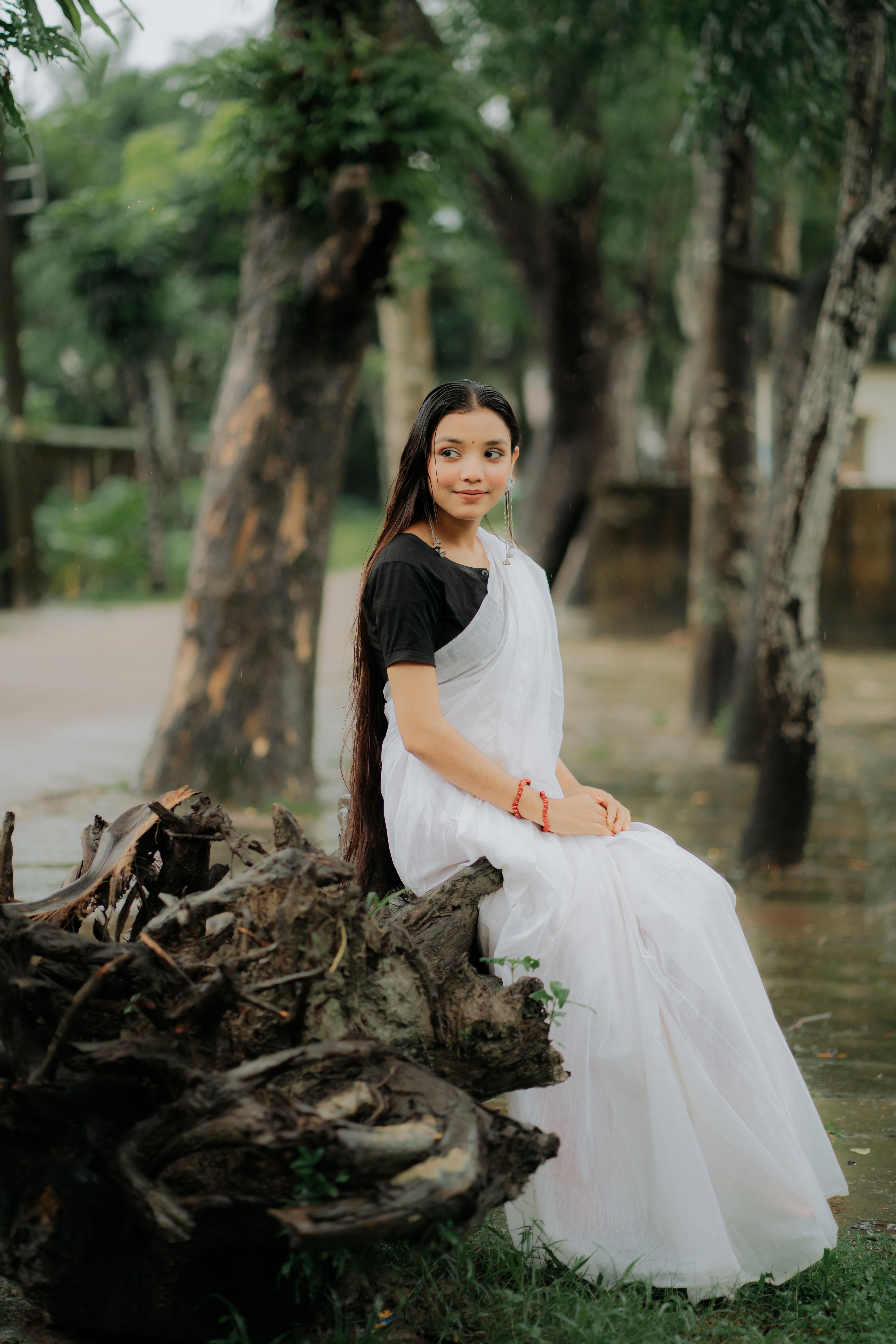 Young Woman in Traditional White Sari Outdoors · Free Stock Photo