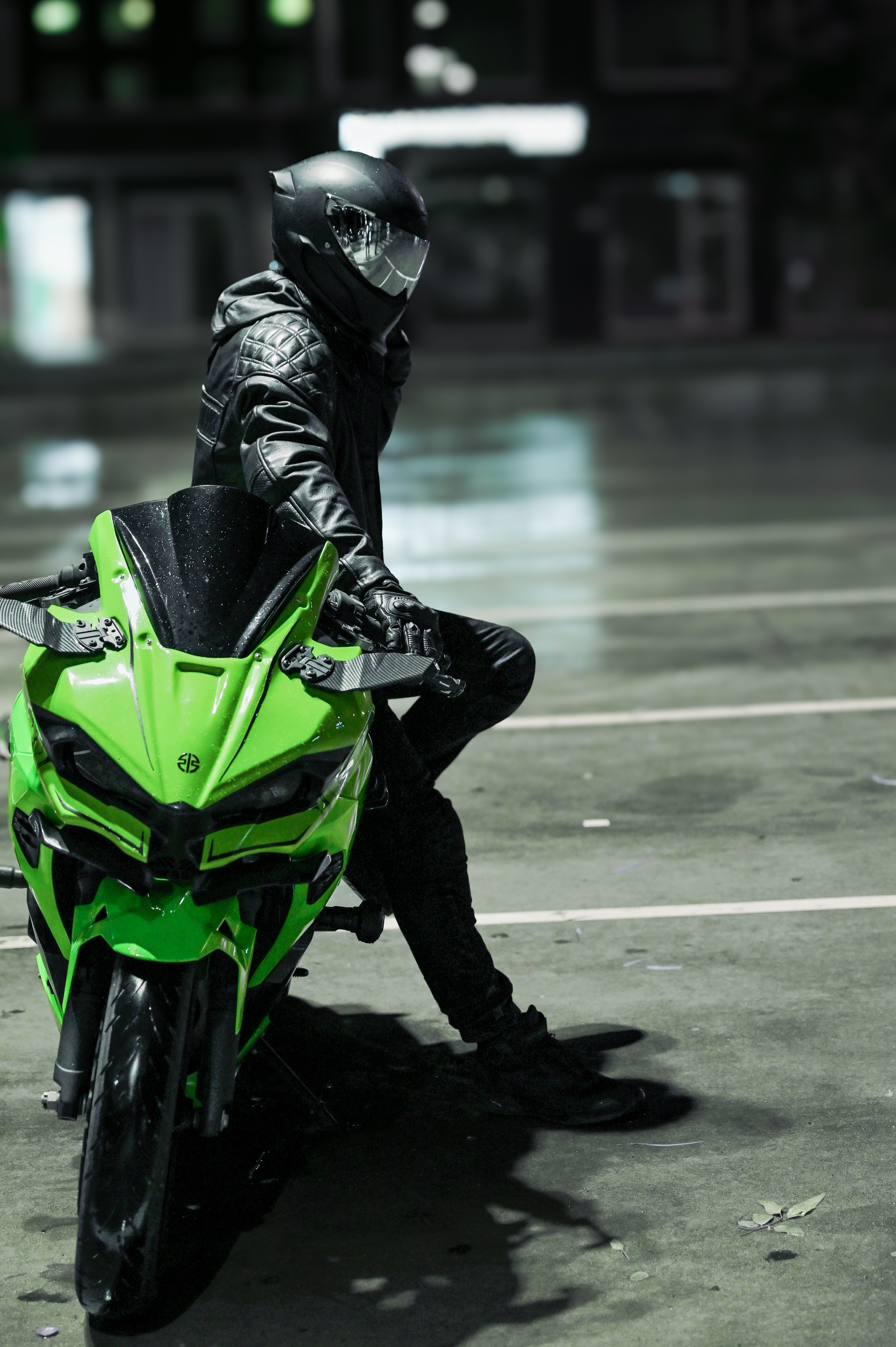 Vibrant Green Motorcycle in Dim Light · Free Stock Photo