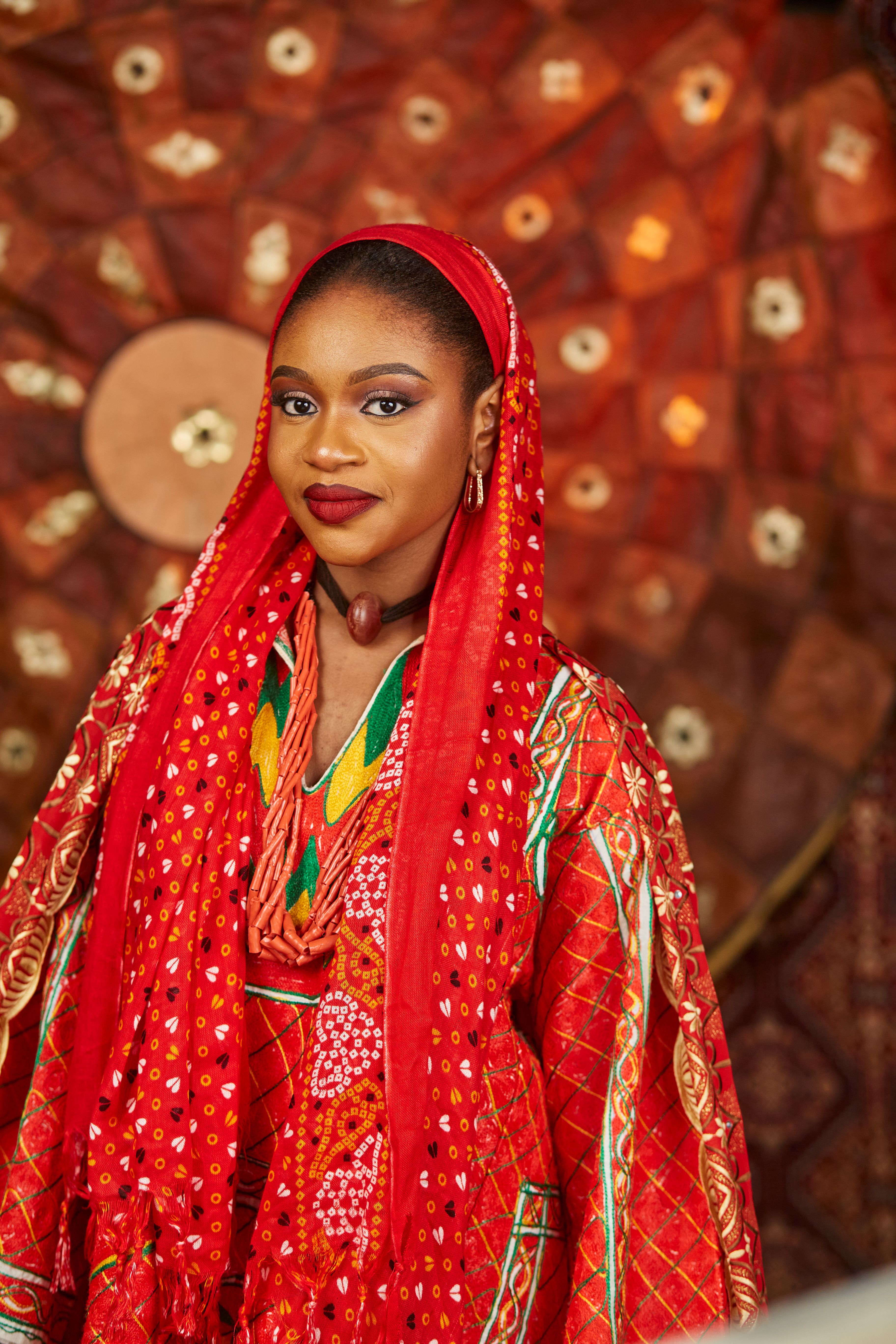 Elegant Woman in Traditional Attire with Rich Patterns · Free Stock Photo