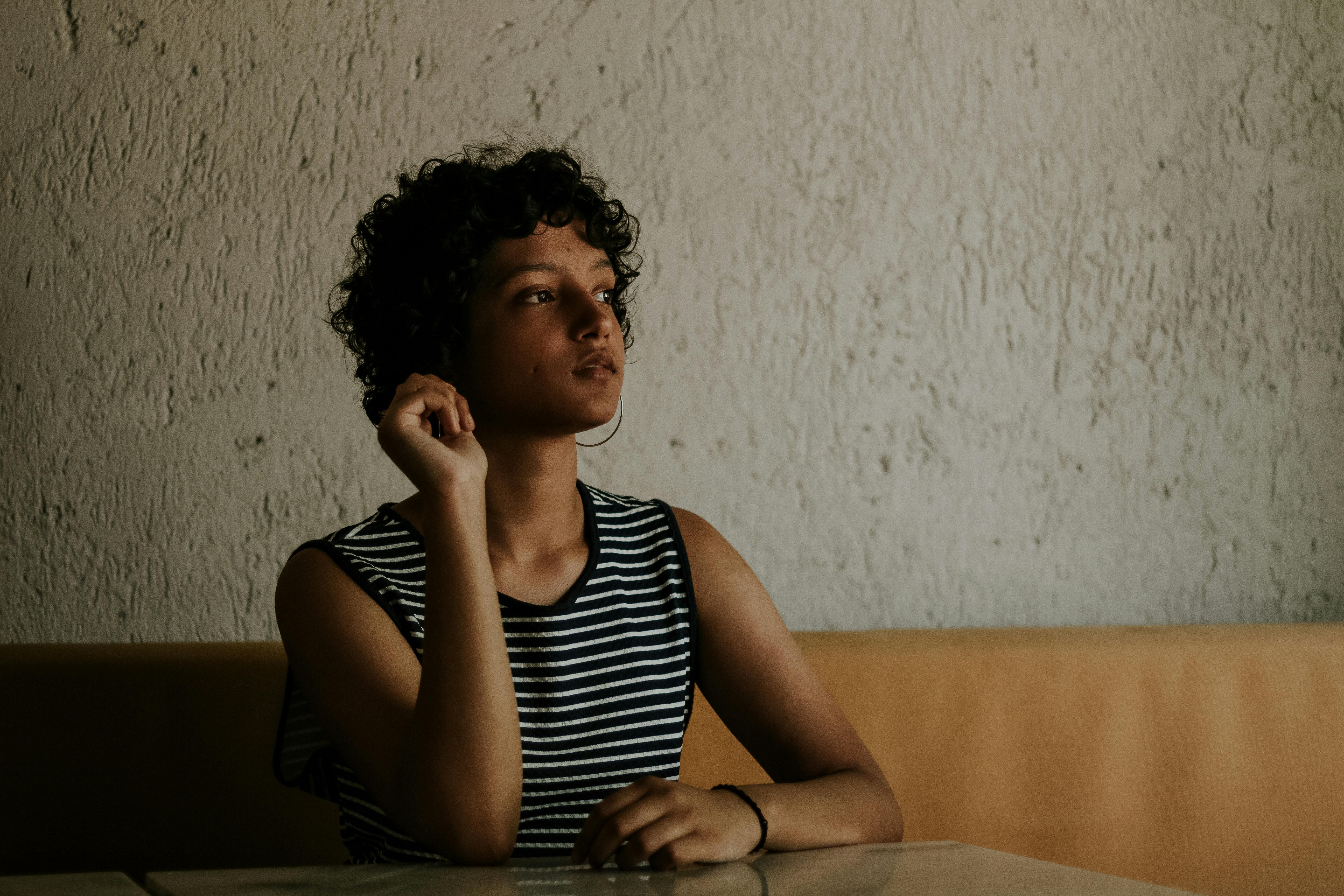 Photo Of Woman Leaning On Table · Free Stock Photo