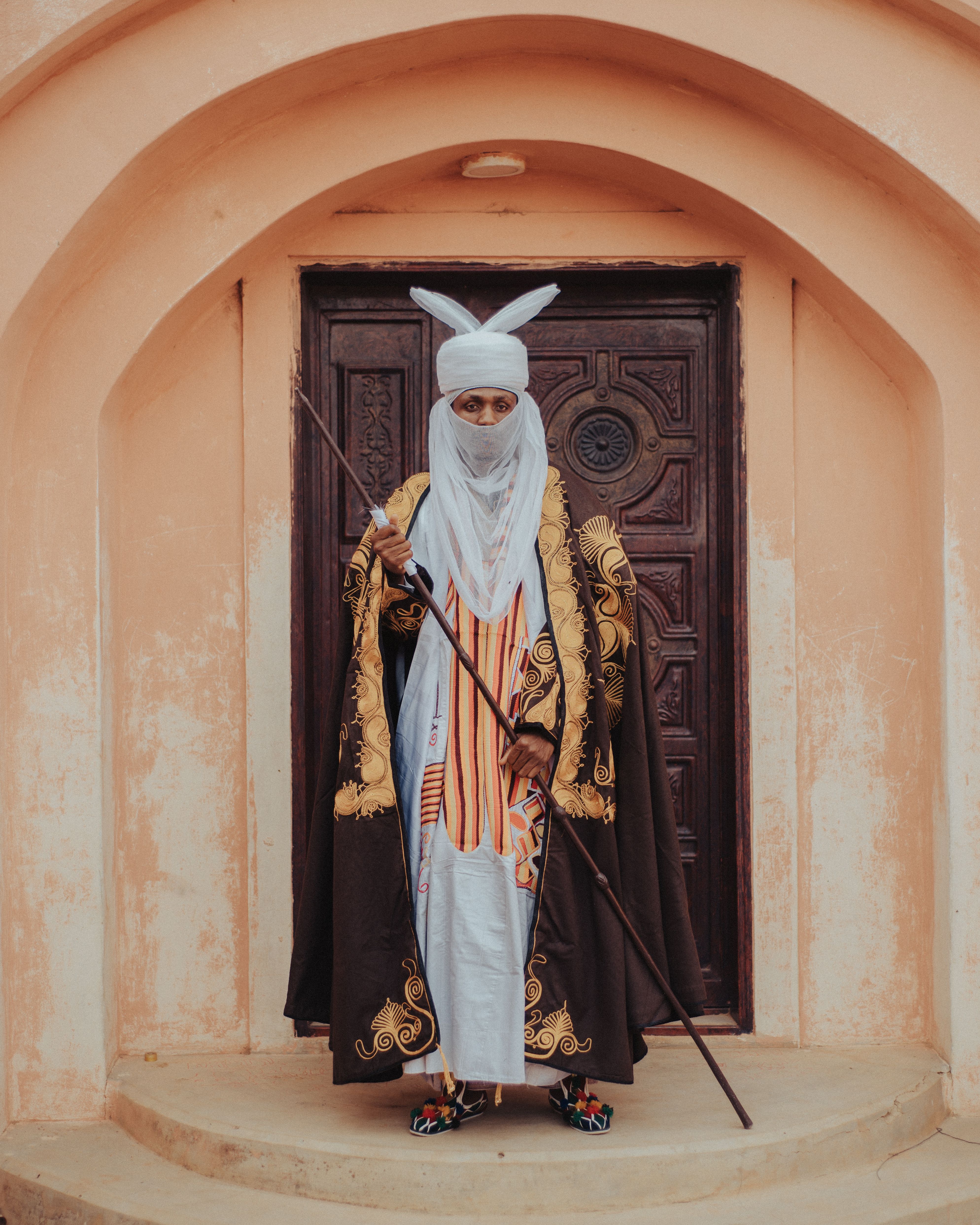 Traditional African Attire in Architectural Setting · Free Stock Photo