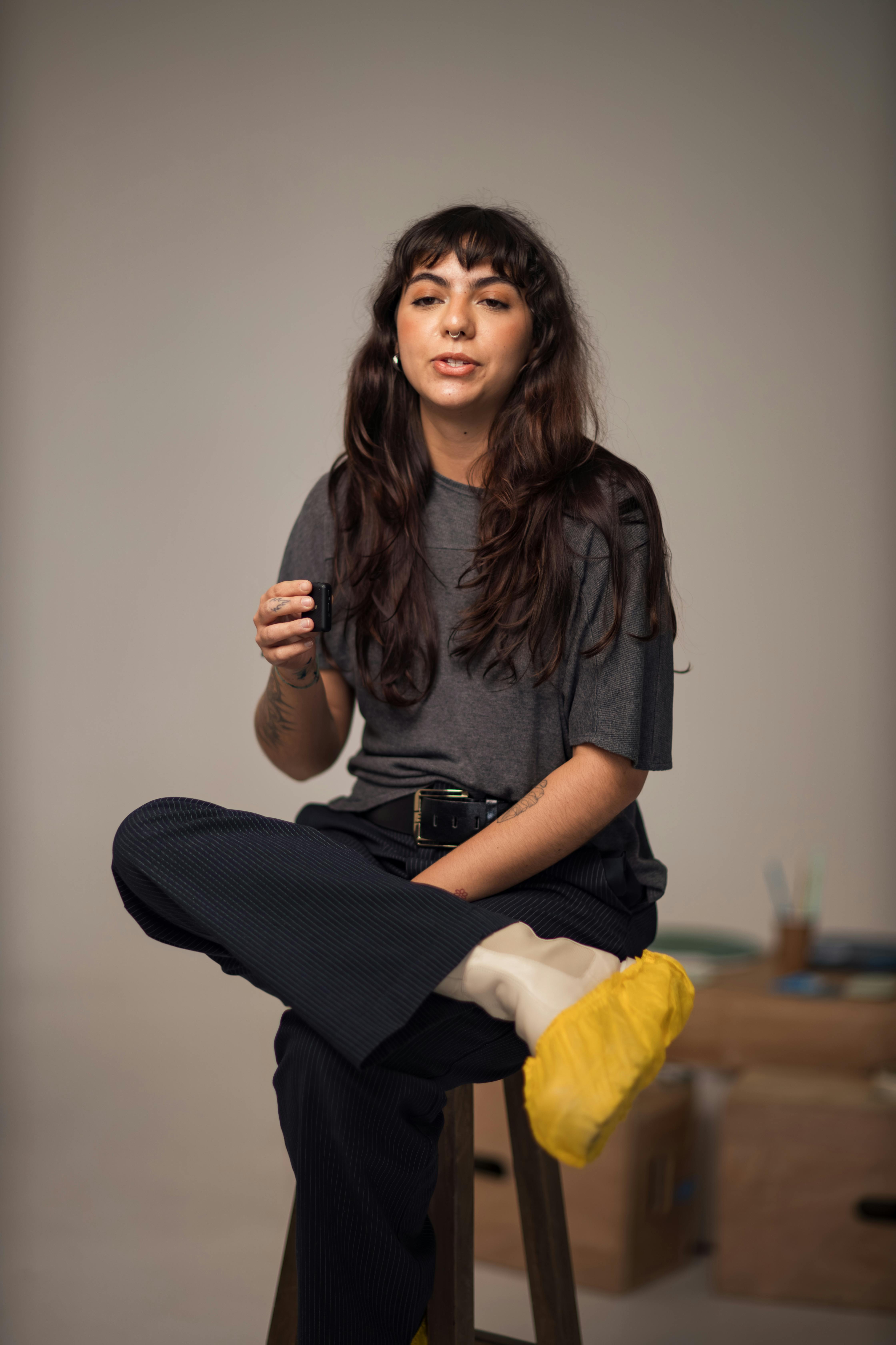 Relaxed Portrait of a Woman in Studio Setting · Free Stock Photo