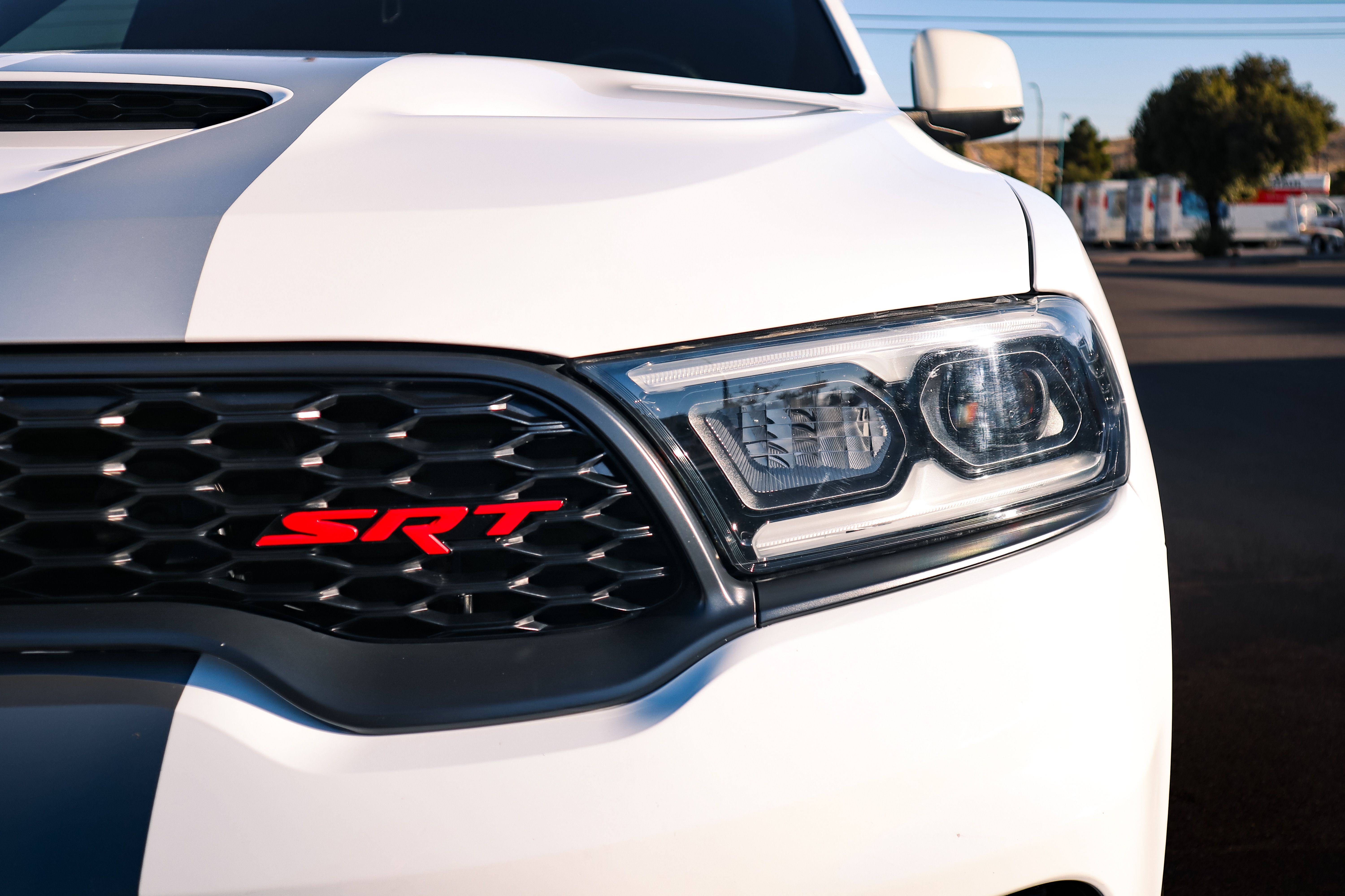 Close-up of Stylish Car Grill with SRT Logo · Free Stock Photo
