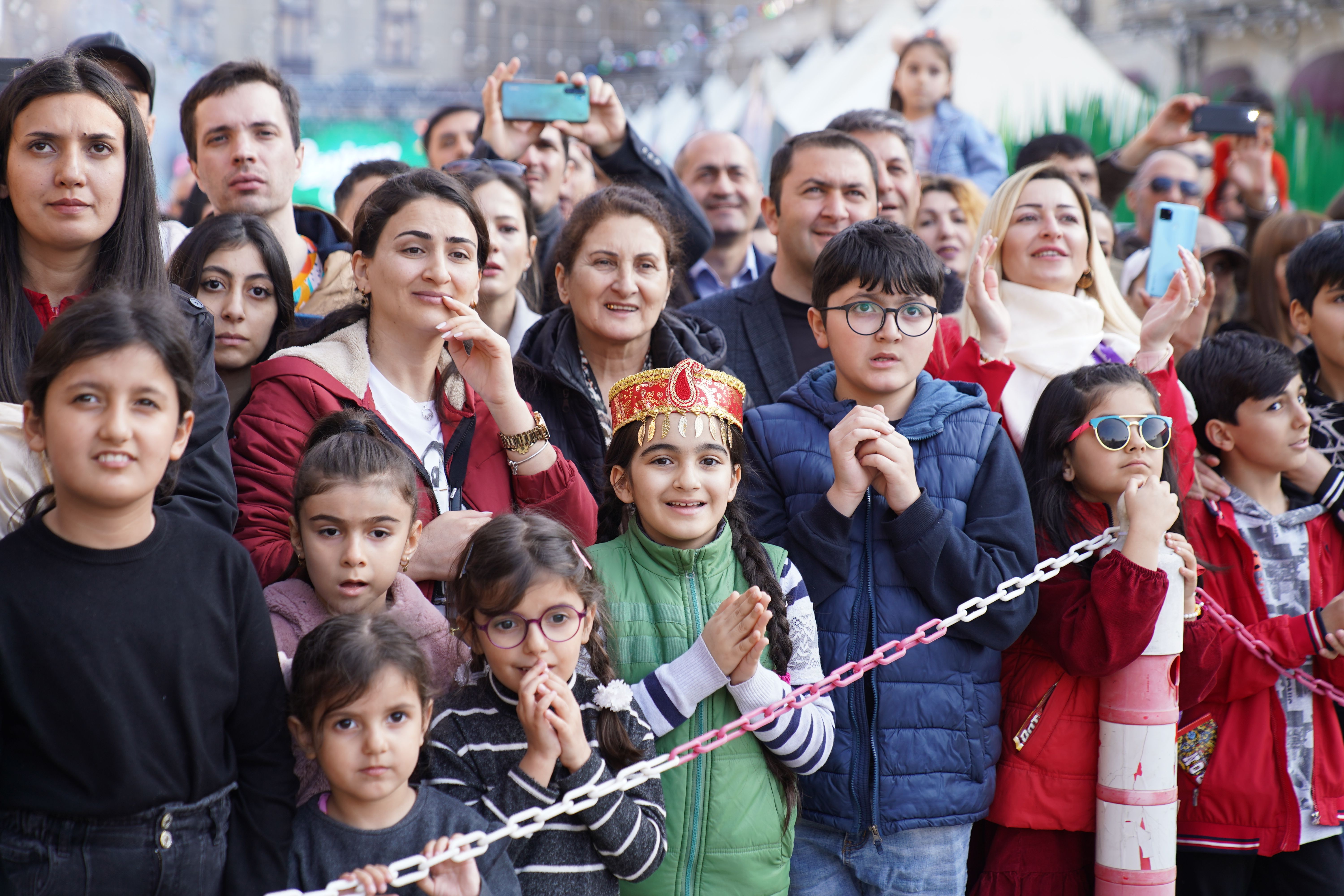 Excited Crowd at Outdoor Cultural Festival · Free Stock Photo