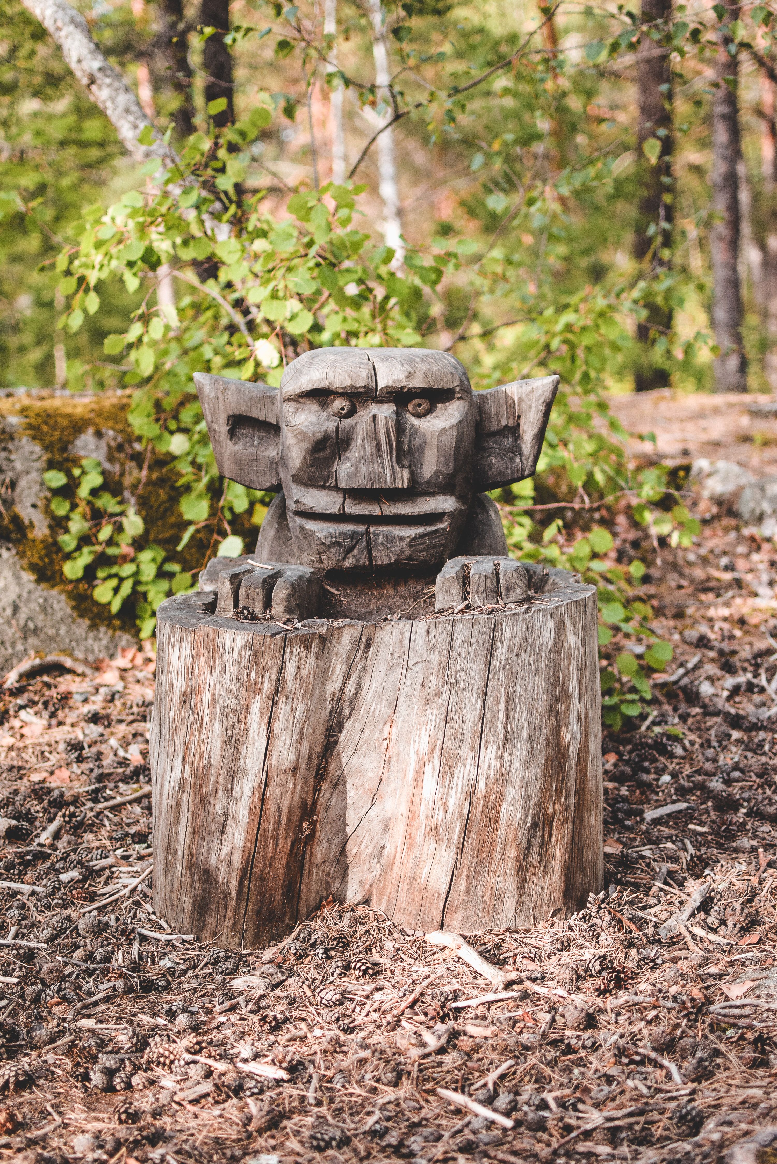 Wooden Goblin Carving in Swedish Forest · Free Stock Photo