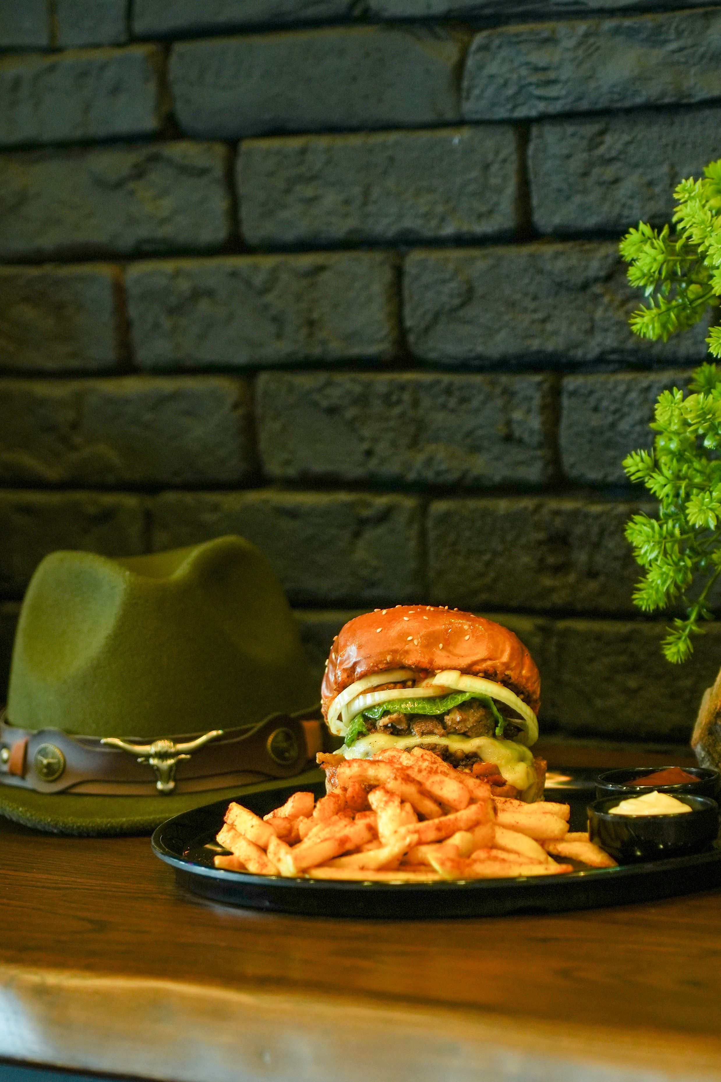 Close-up of Burger with Fries and Felt Hat · Free Stock Photo