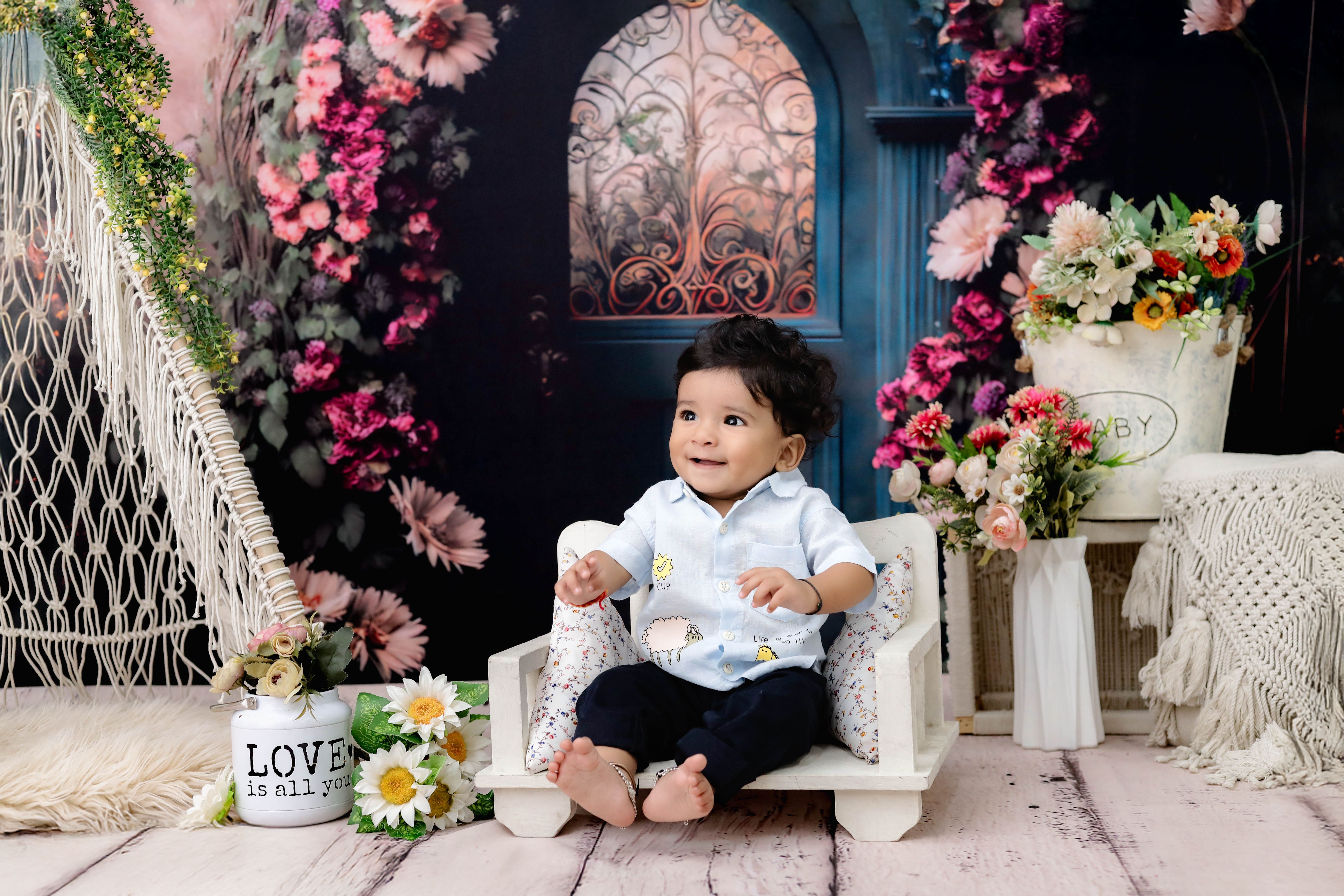 Charming Baby in Floral Themed Indoor Photoshoot · Free Stock Photo