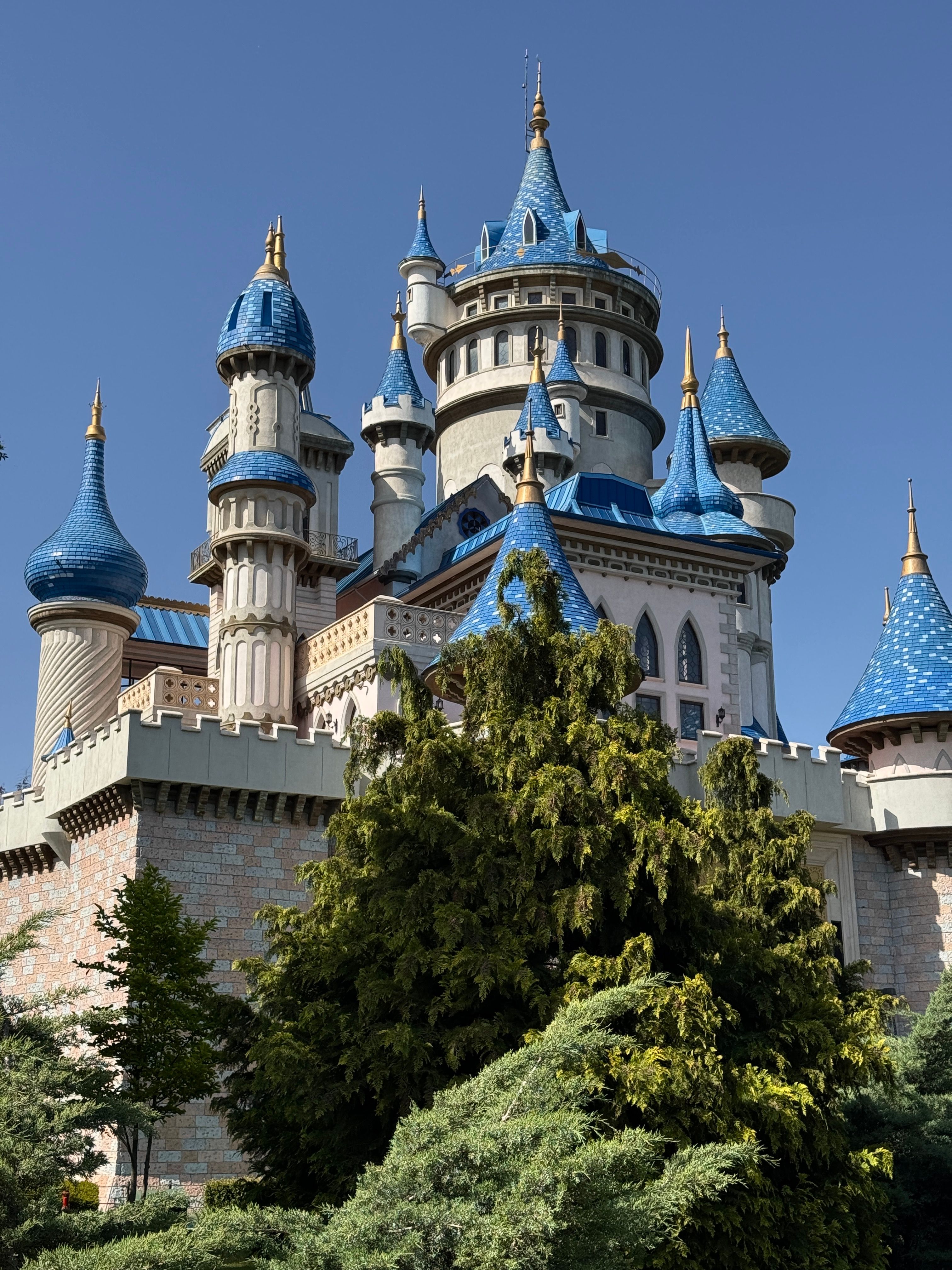 Enchanting Blue Castle with Turrets in Sunlight · Free Stock Photo