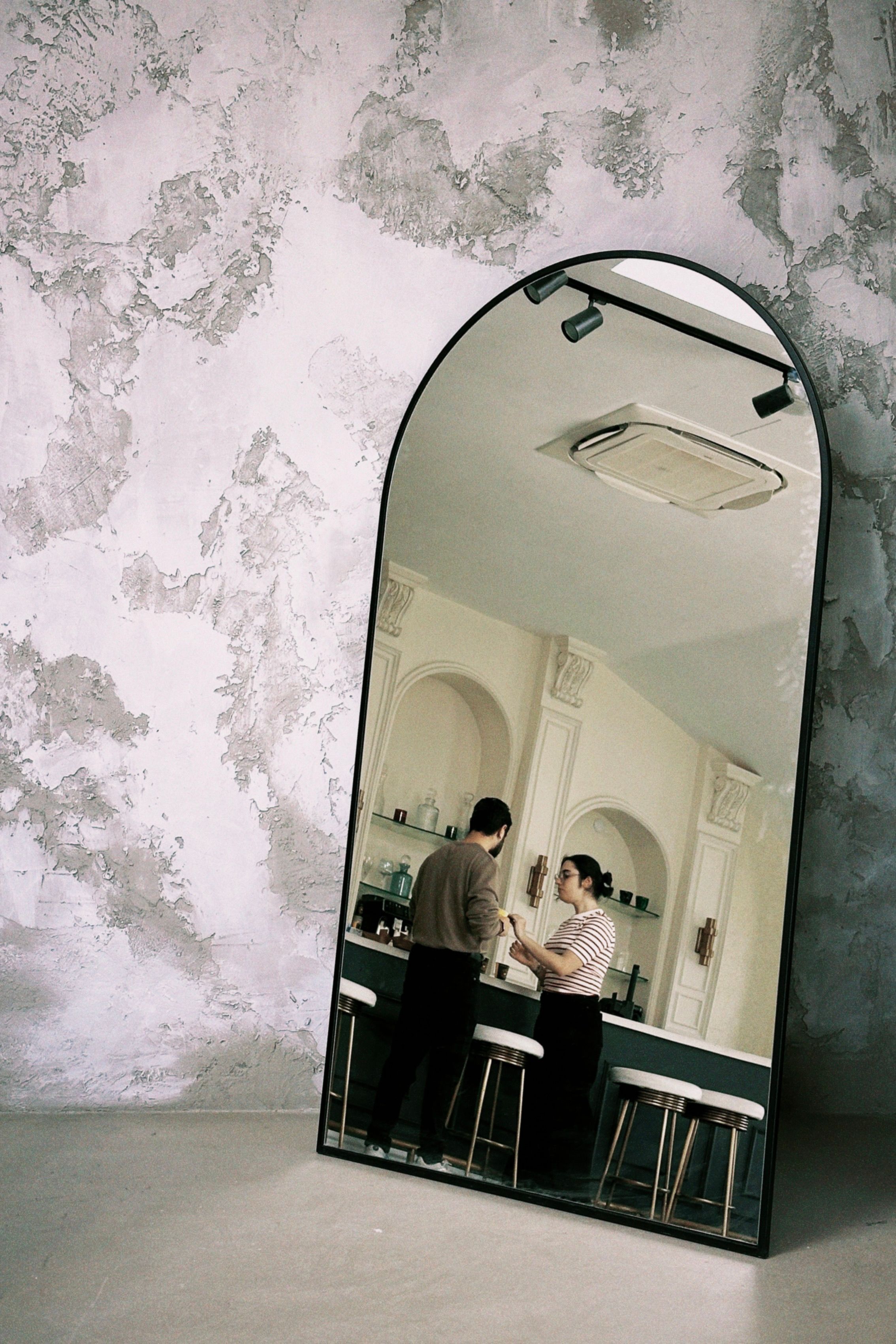 Elegant Mirror Reflection of a Modern Cafe Interaction · Free Stock Photo