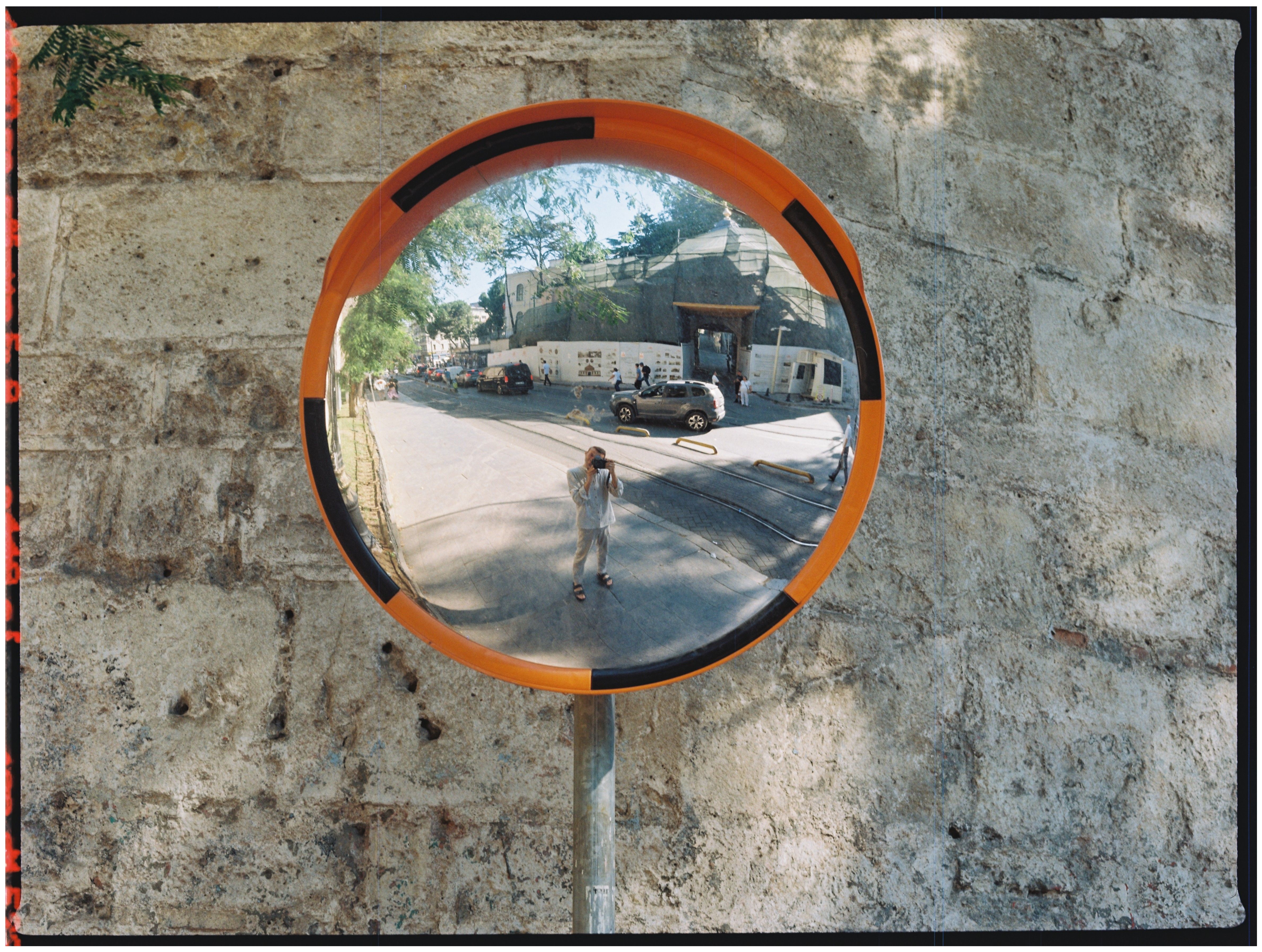Reflection in Convex Mirror on Stone Wall · Free Stock Photo