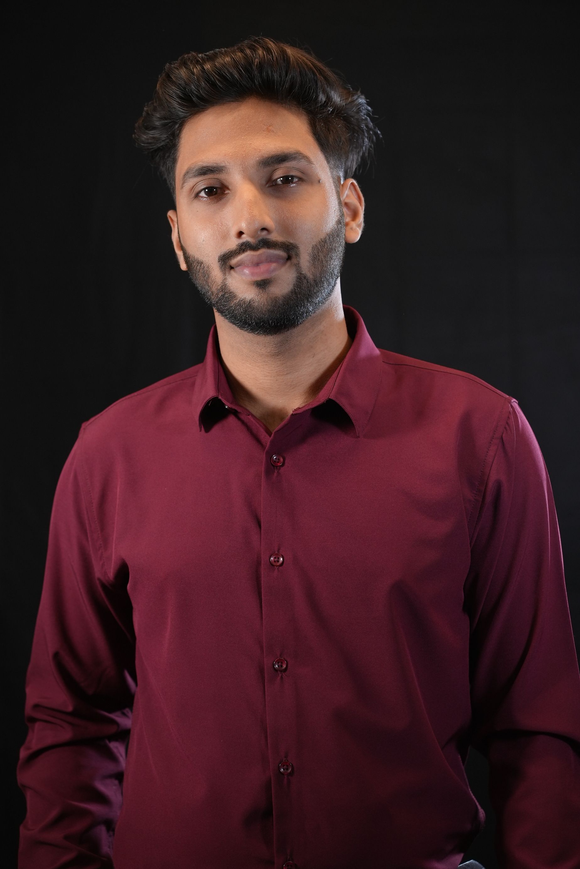 Professional Portrait of Young Man in Maroon Shirt · Free Stock Photo