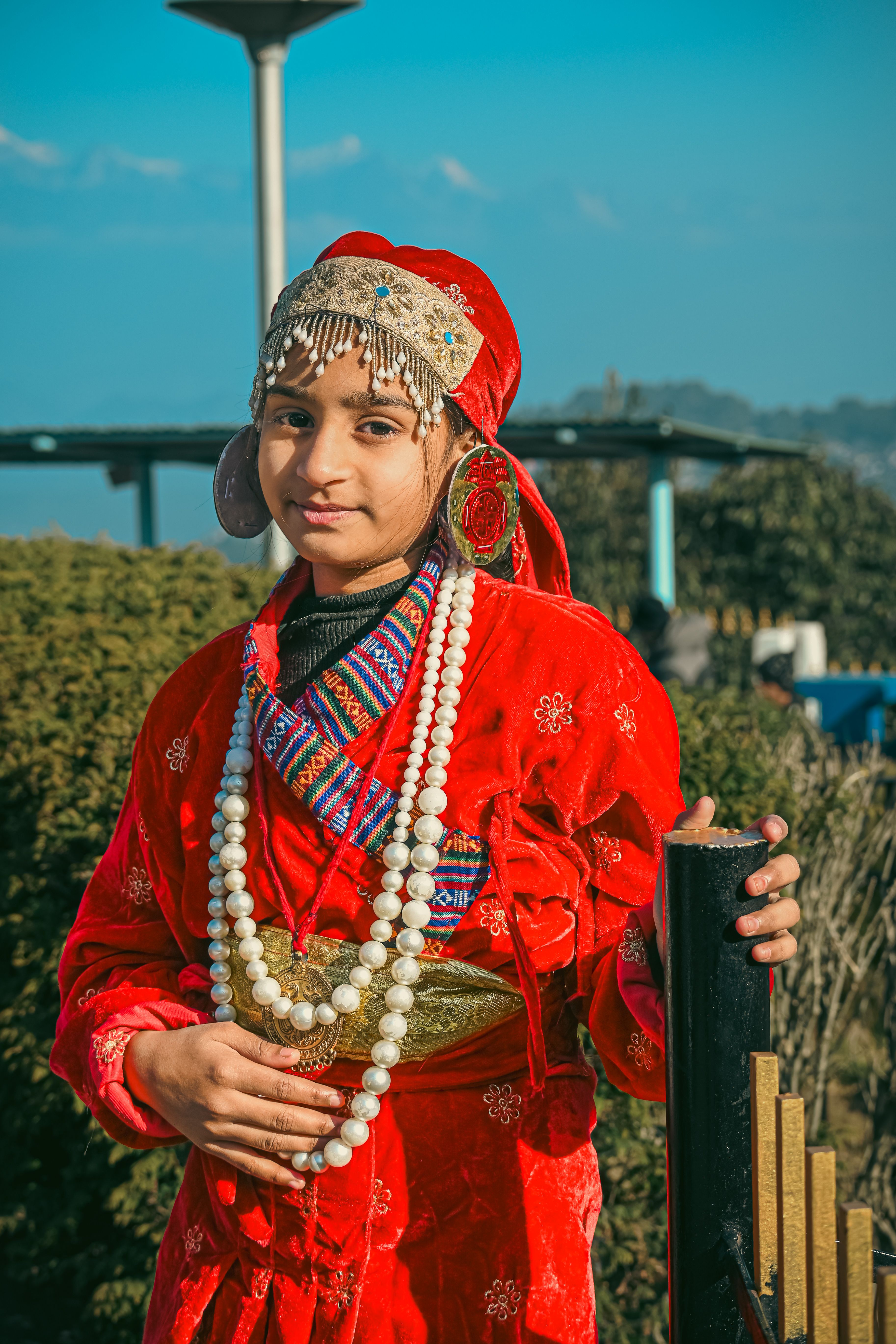 Young Girl in Traditional Darjeeling Attire Outdoors · Free Stock Photo