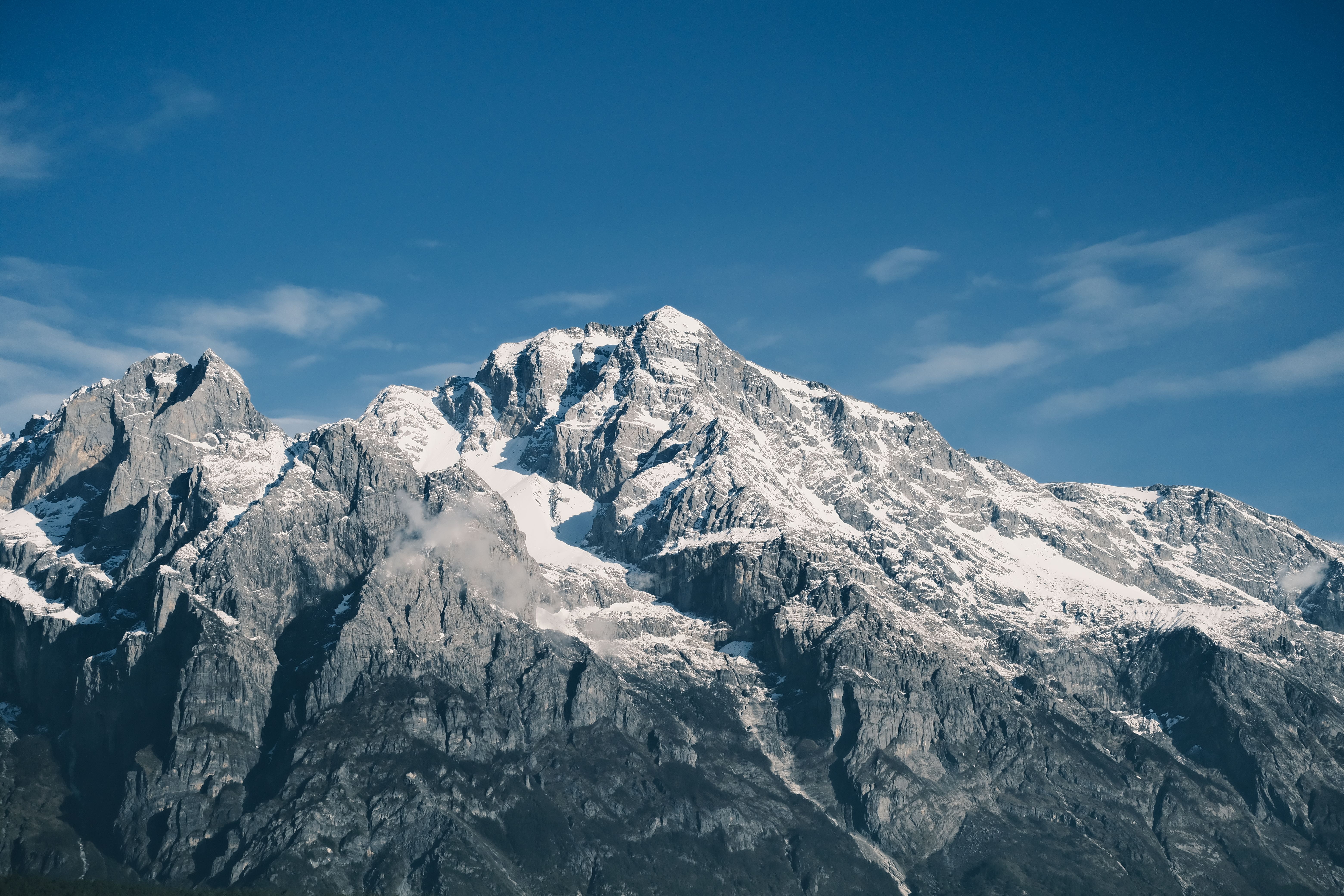Majestic Snow-Capped Mountain Peaks Under Blue Sky · Free Stock Photo