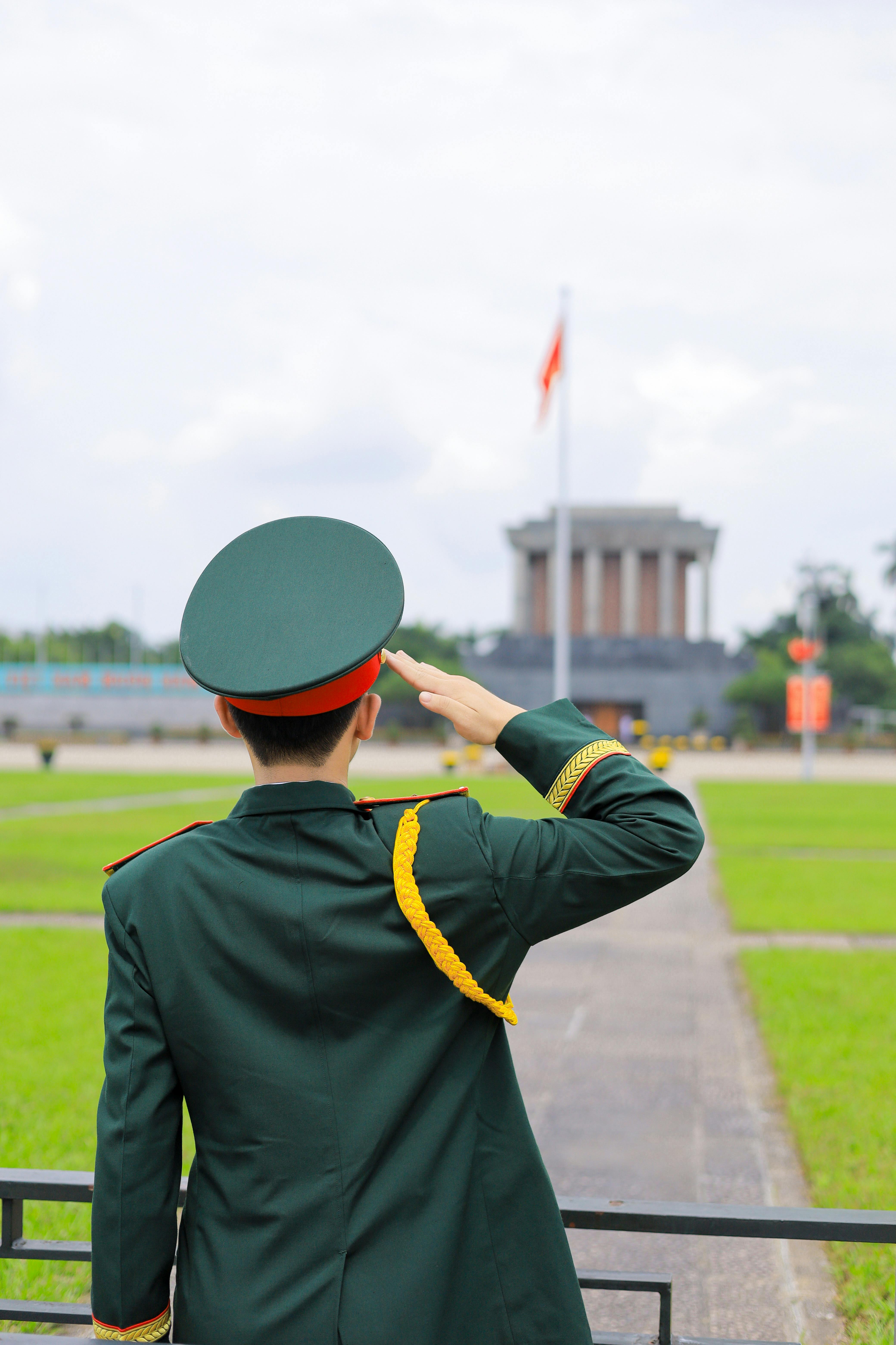 Vietnamese Soldier Saluting Ho Chi Minh Mausoleum · Free Stock Photo
