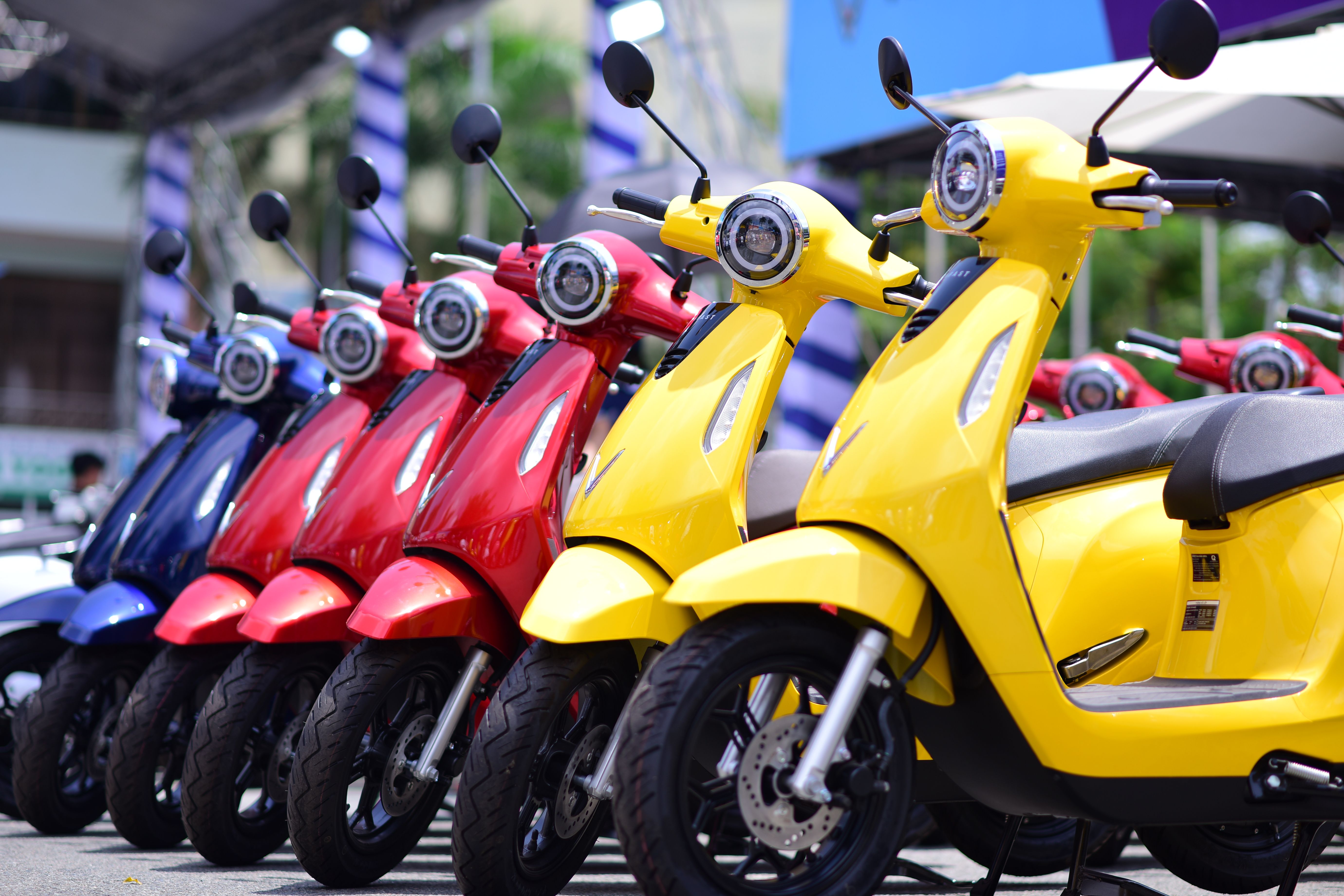 Colorful Scooters Lined Up in Urban Setting · Free Stock Photo