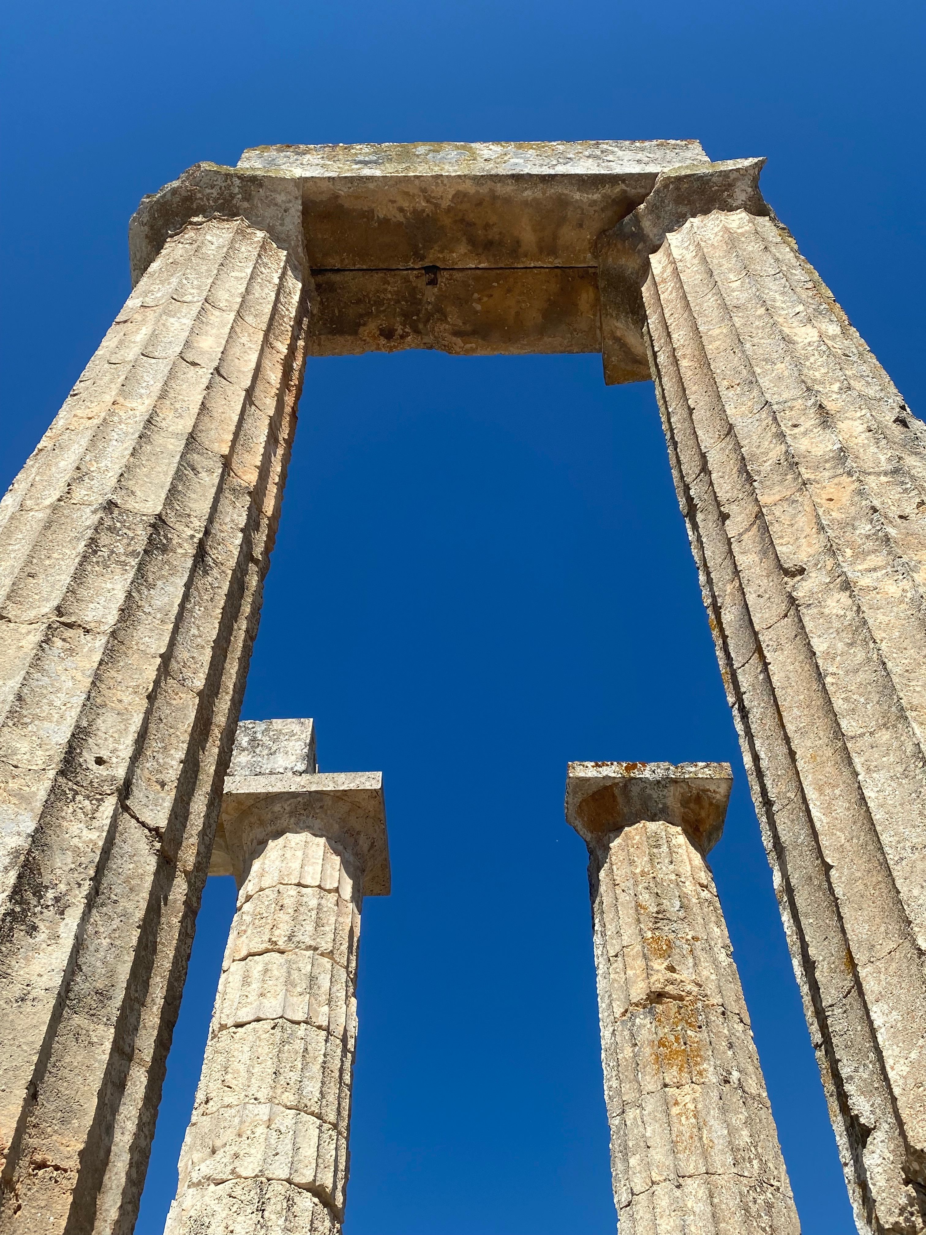 Ancient Greek Columns Against Clear Blue Sky · Free Stock Photo