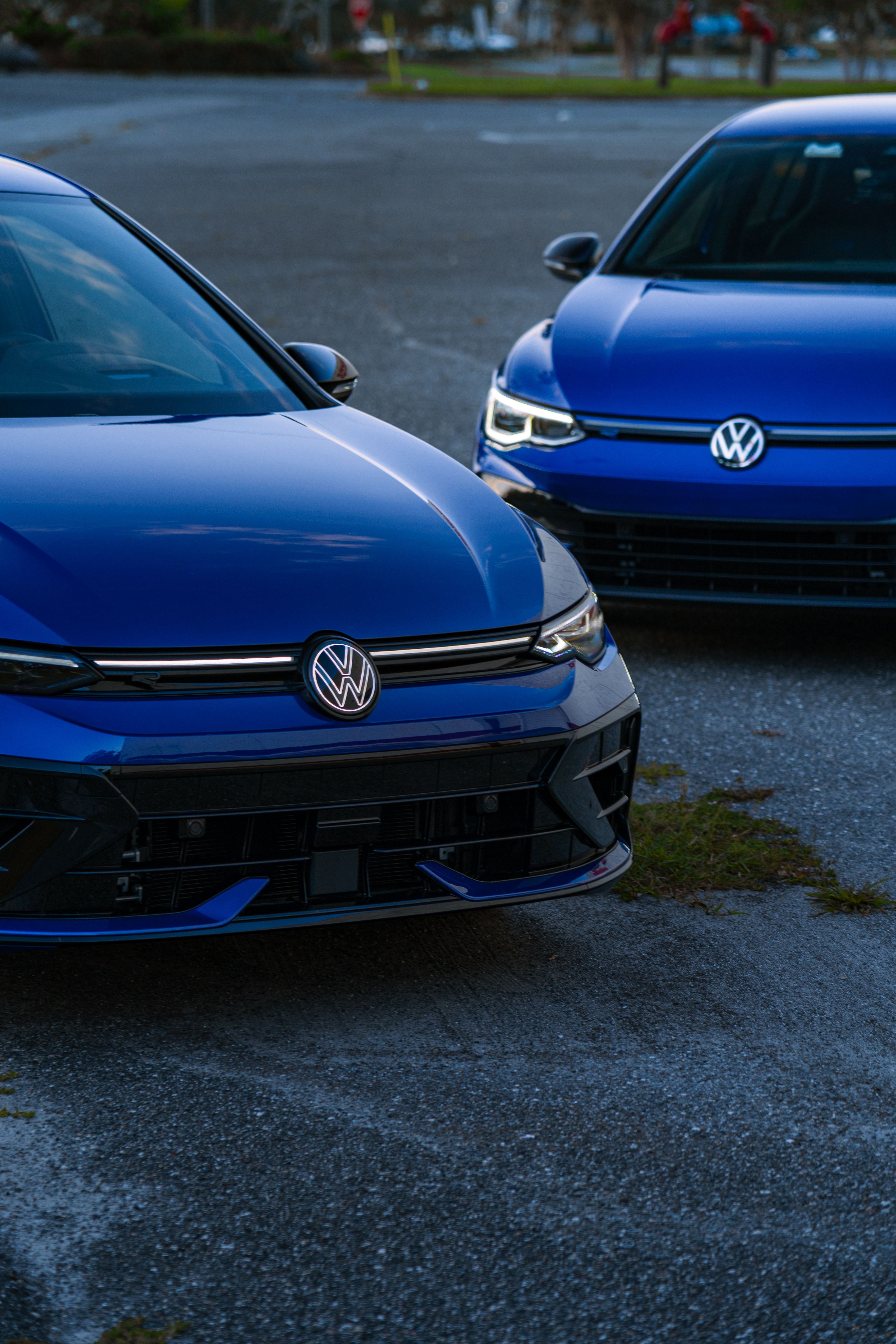 Sleek Blue Cars Parked Outdoors in Dusk Lighting · Free Stock Photo