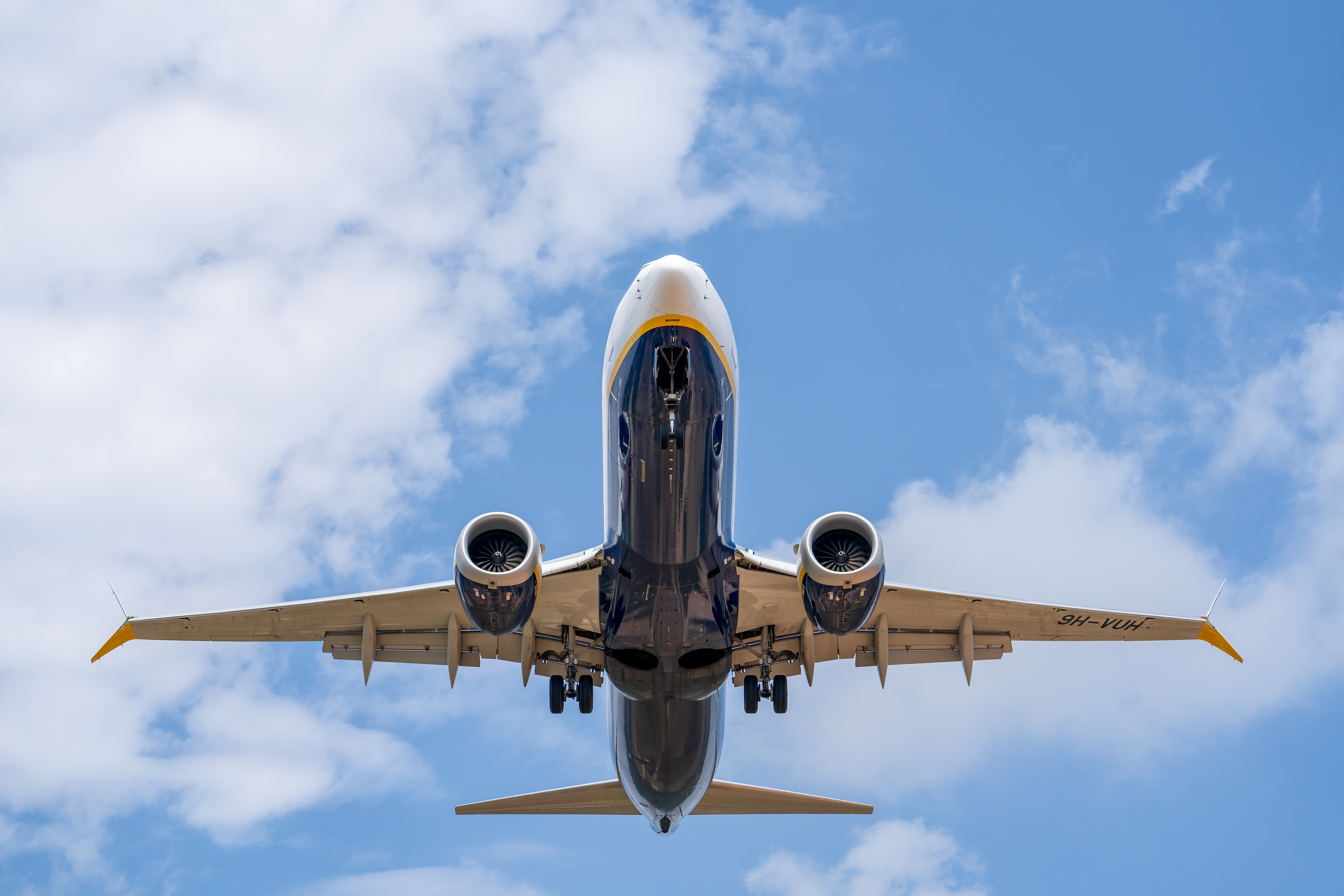 Airplane in Flight Against Blue Sky Over Spain · Free Stock Photo