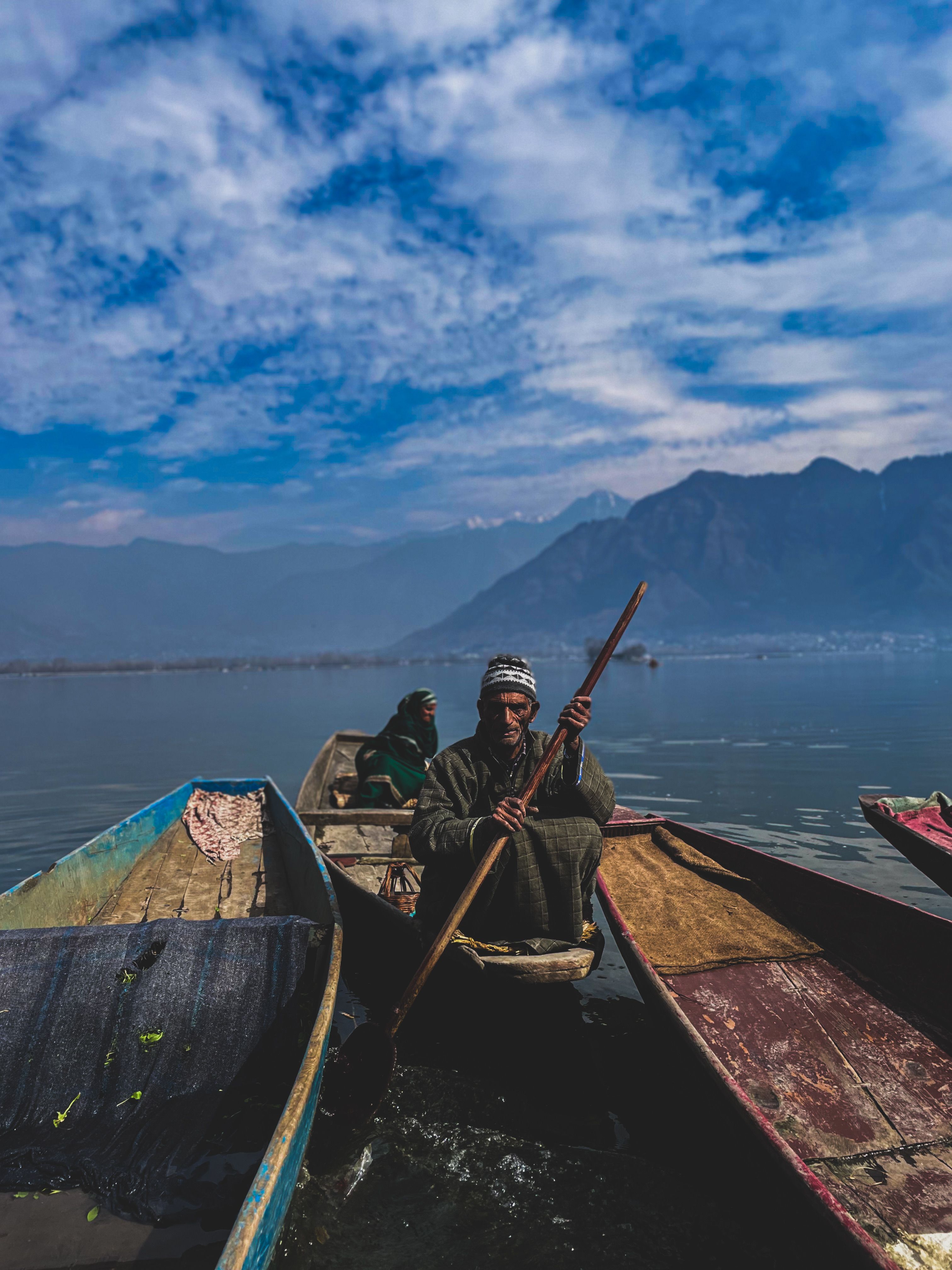 Tranquil Boat Ride on Scenic Mountain Lake · Free Stock Photo