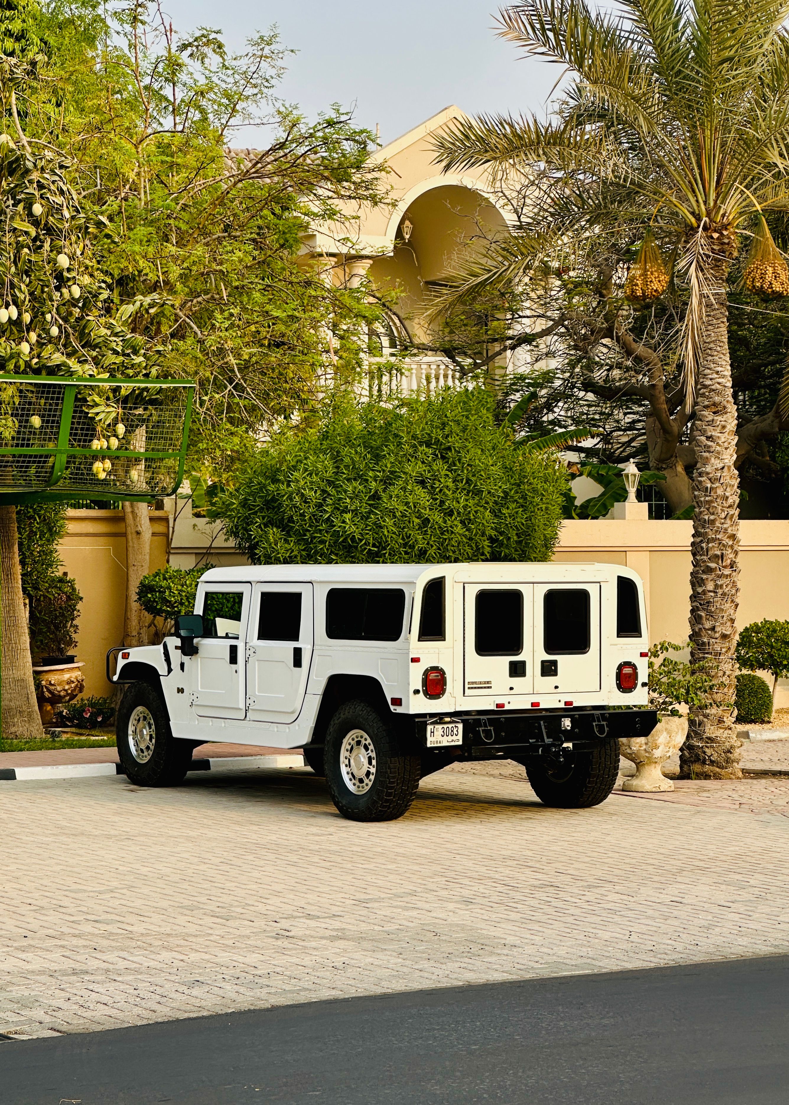 Luxury SUV Parked in Front of Elegant Villa · Free Stock Photo