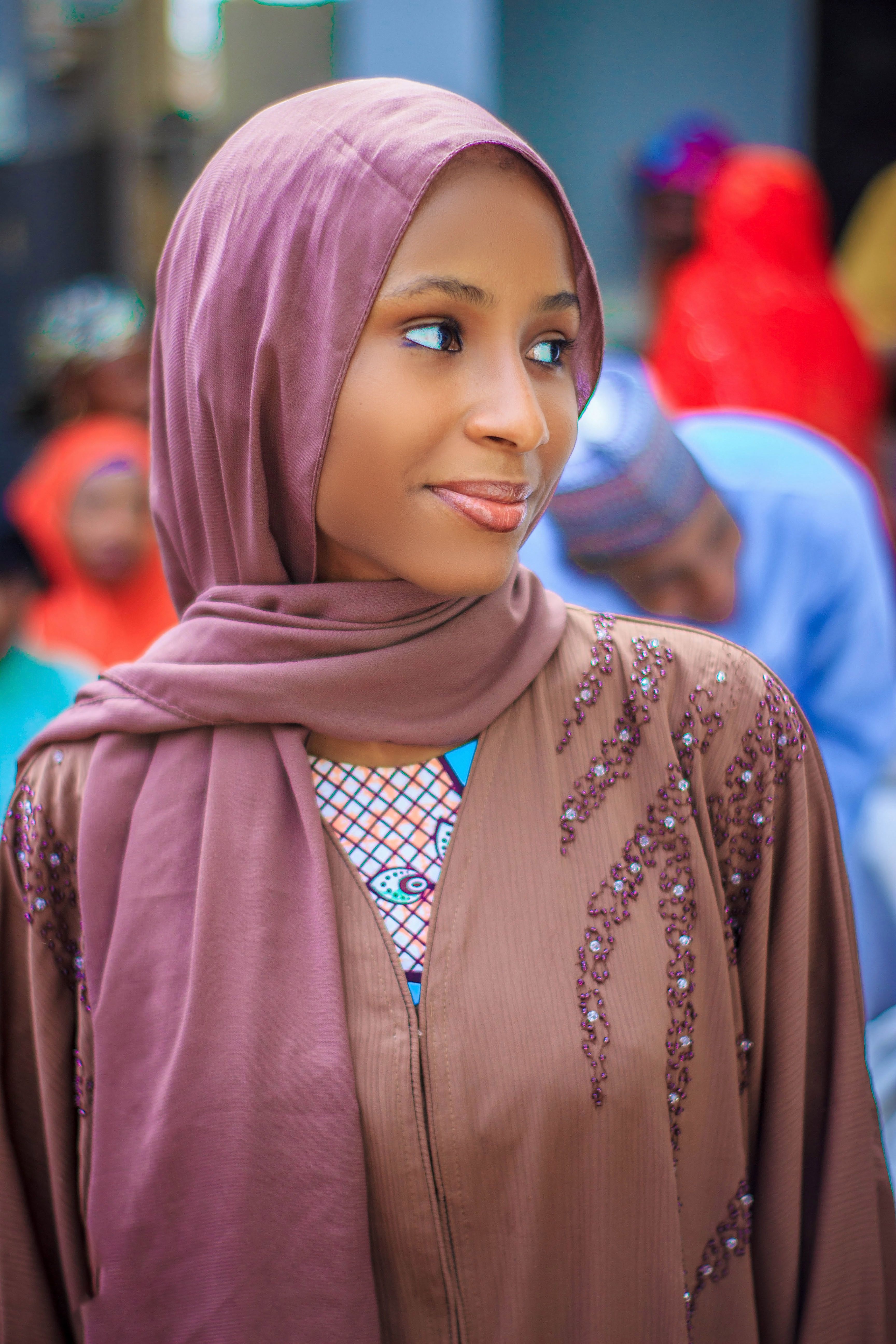 Young Woman in Stylish Hijab Smiling Outdoors · Free Stock Photo
