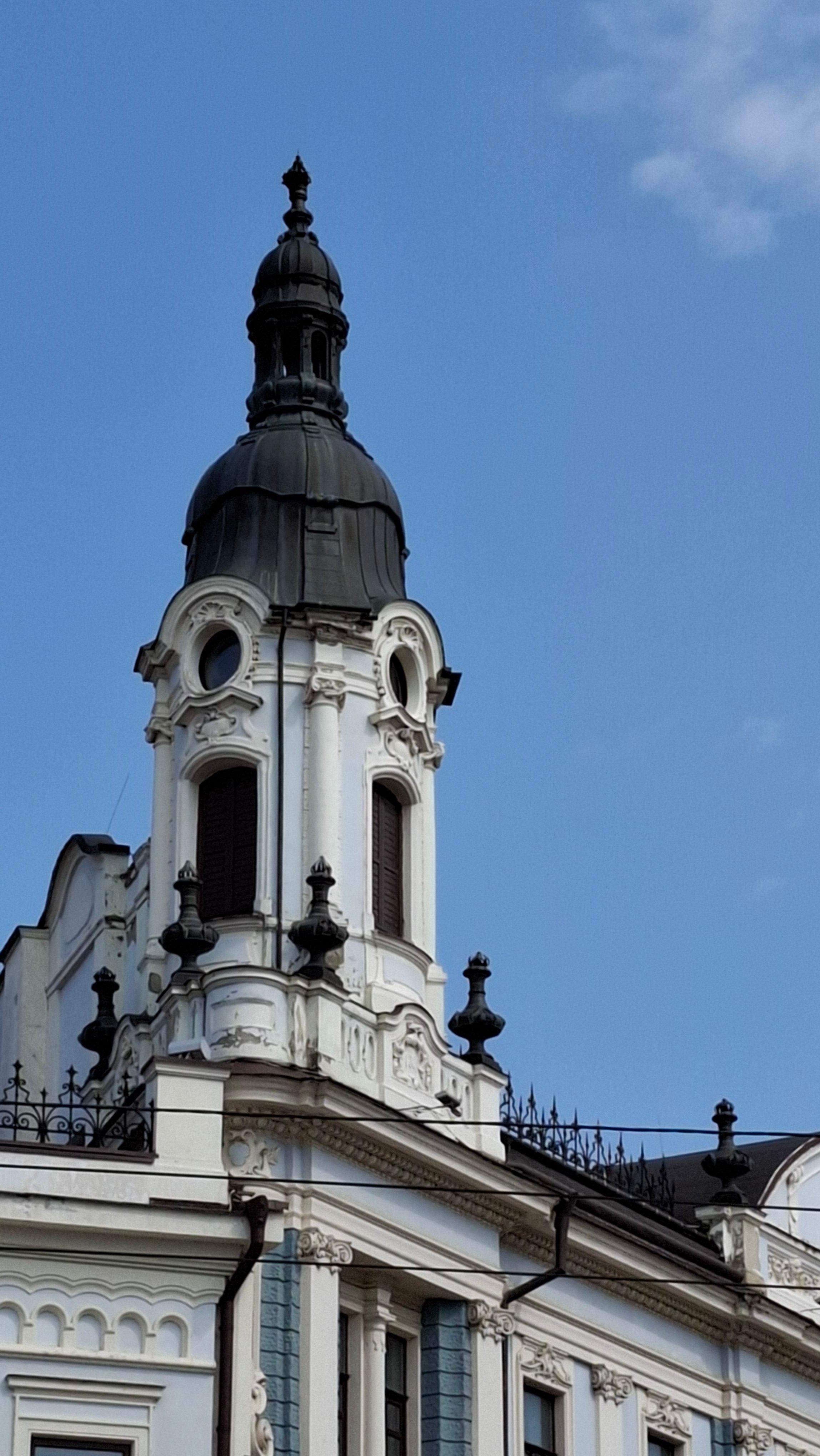 Ornate Building Spire Against Blue Sky · Free Stock Photo