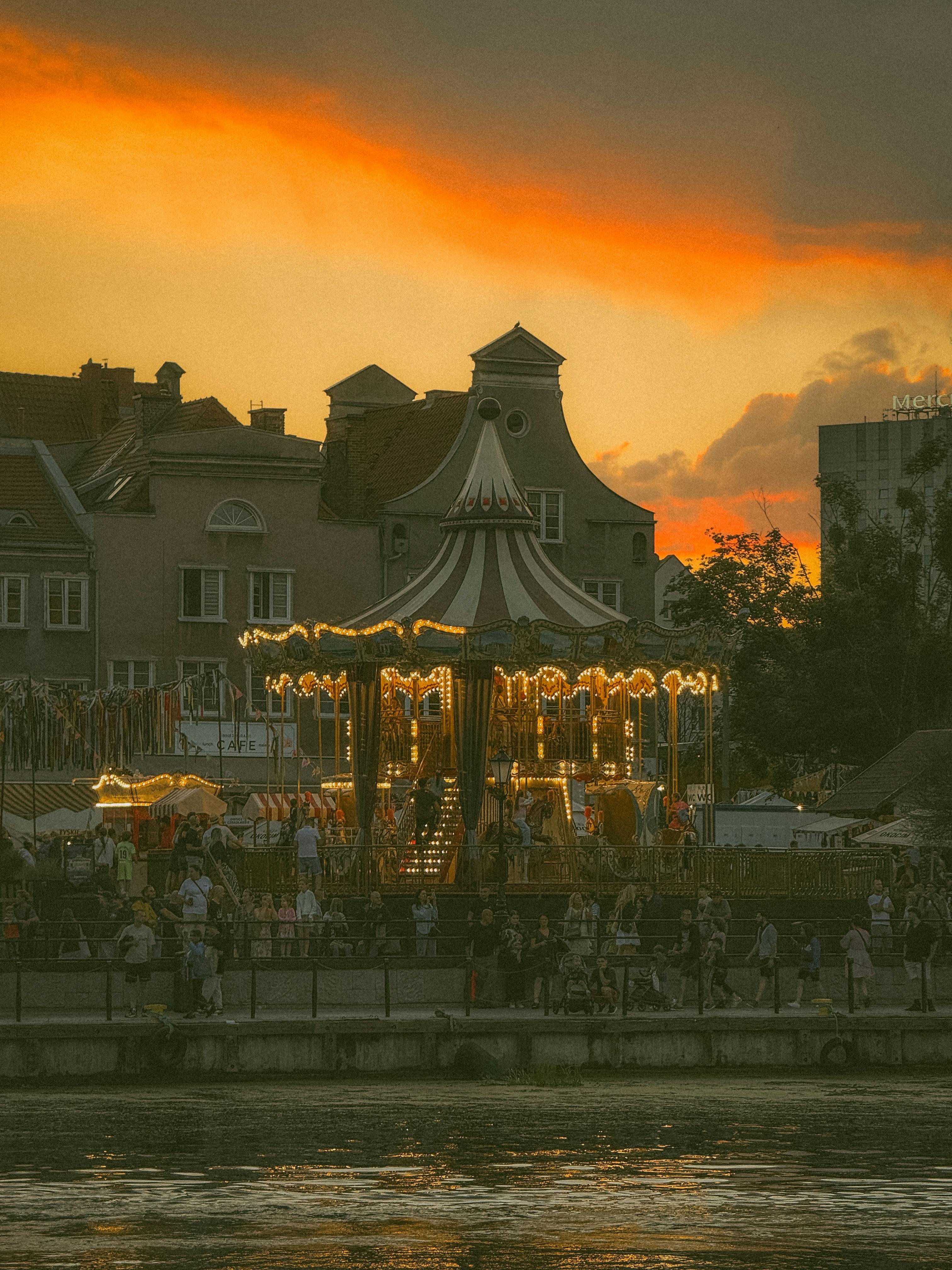 Enchanting Carousel at Sunset by River · Free Stock Photo