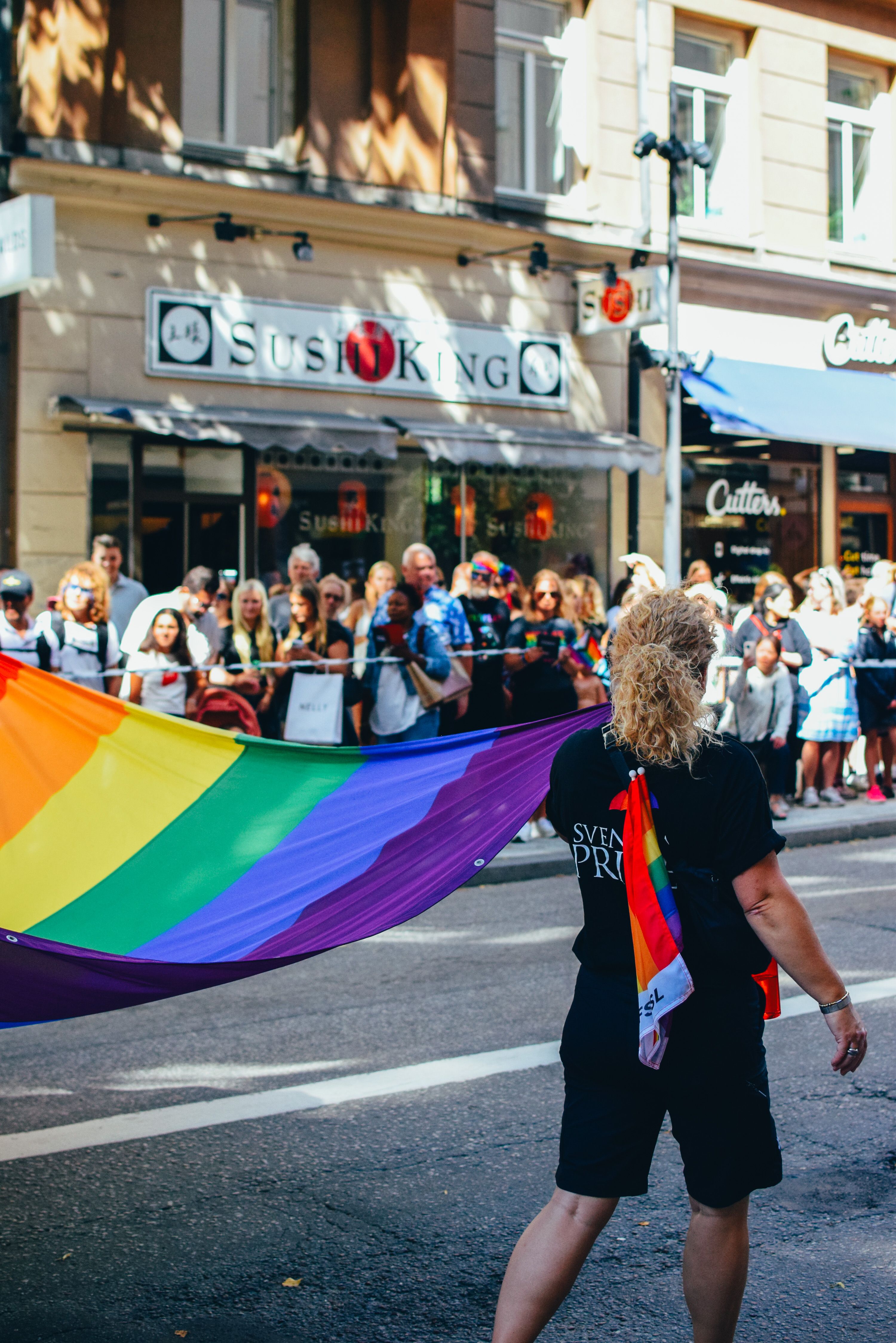 Vibrant Pride Parade in Stockholm Street · Free Stock Photo