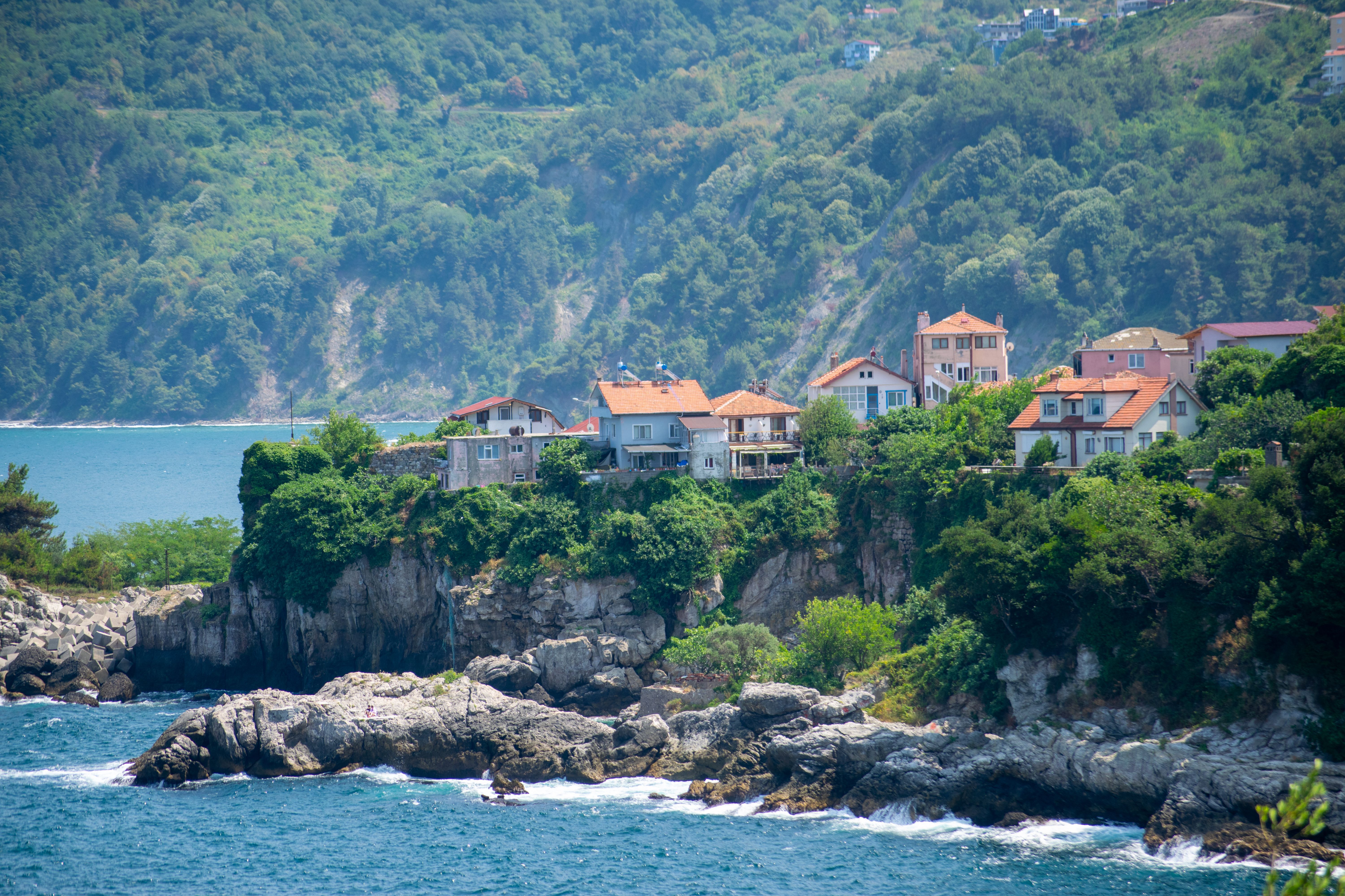 Scenic Coastal Village Overlooking Blue Sea · Free Stock Photo