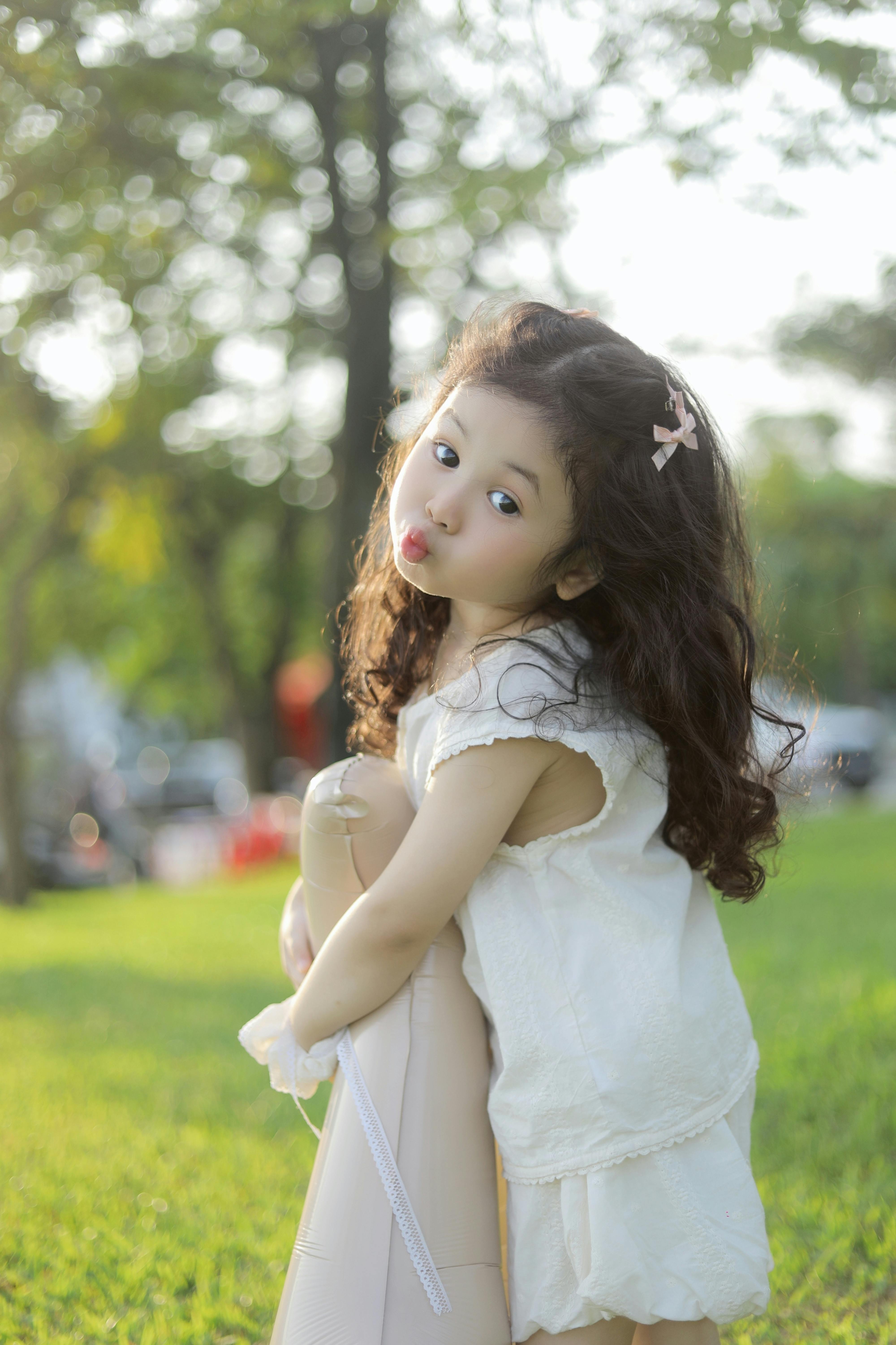 Adorable Child Enjoying Sunny Day in Bắc Ninh · Free Stock Photo