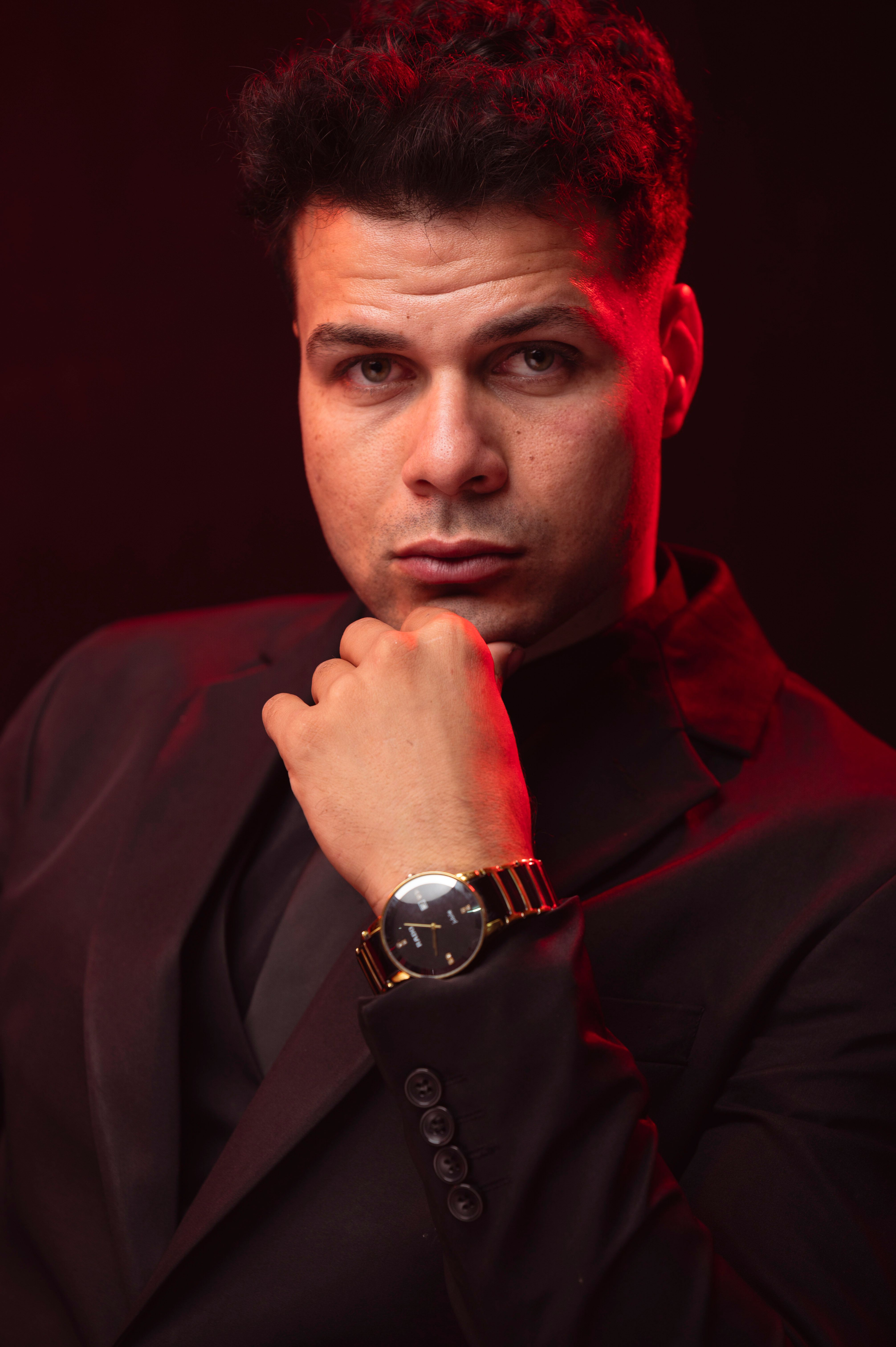 Confident Man in Suit with Dramatic Lighting · Free Stock Photo
