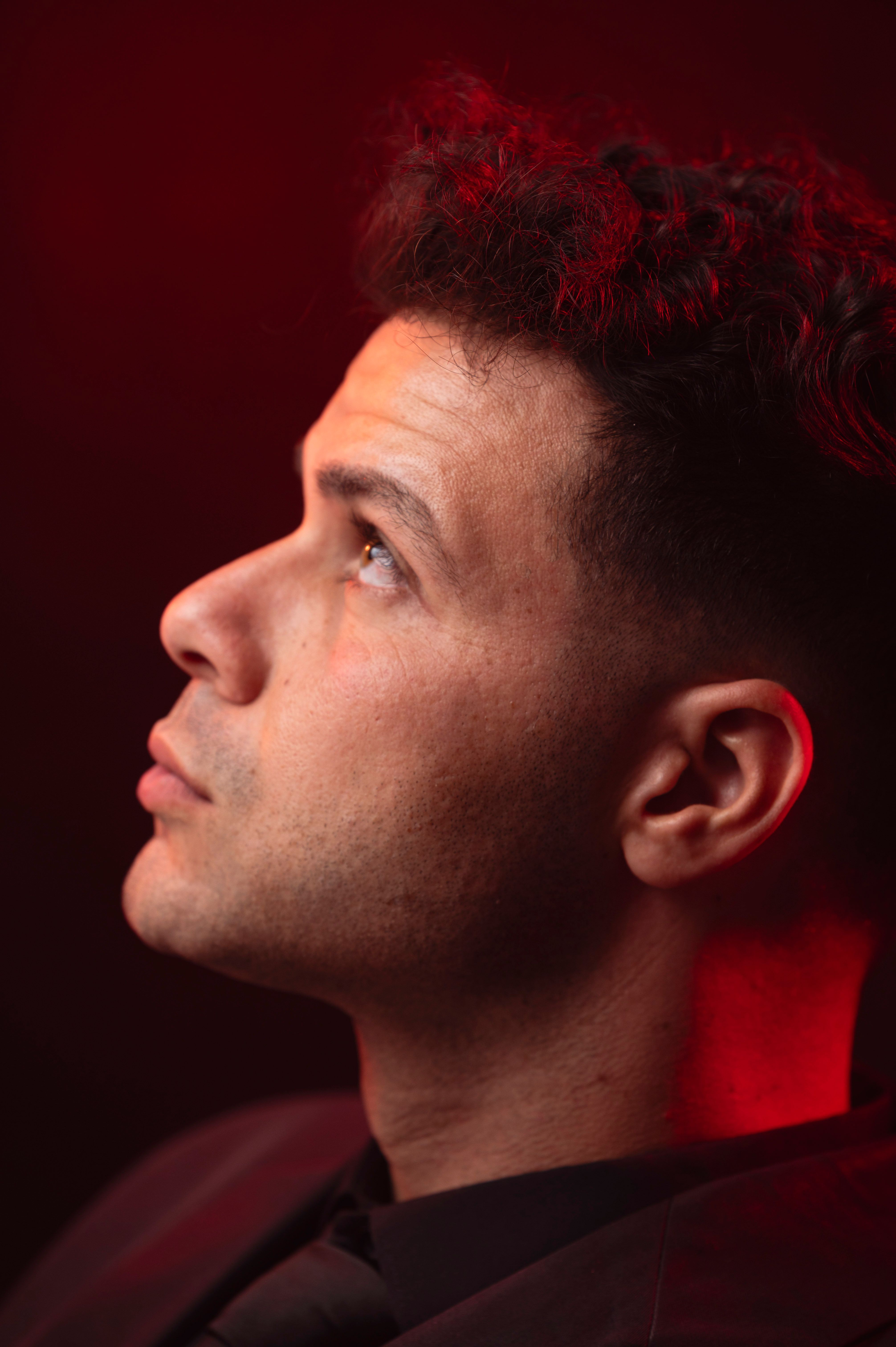 Dramatic Portrait of a Man in Red Lighting · Free Stock Photo