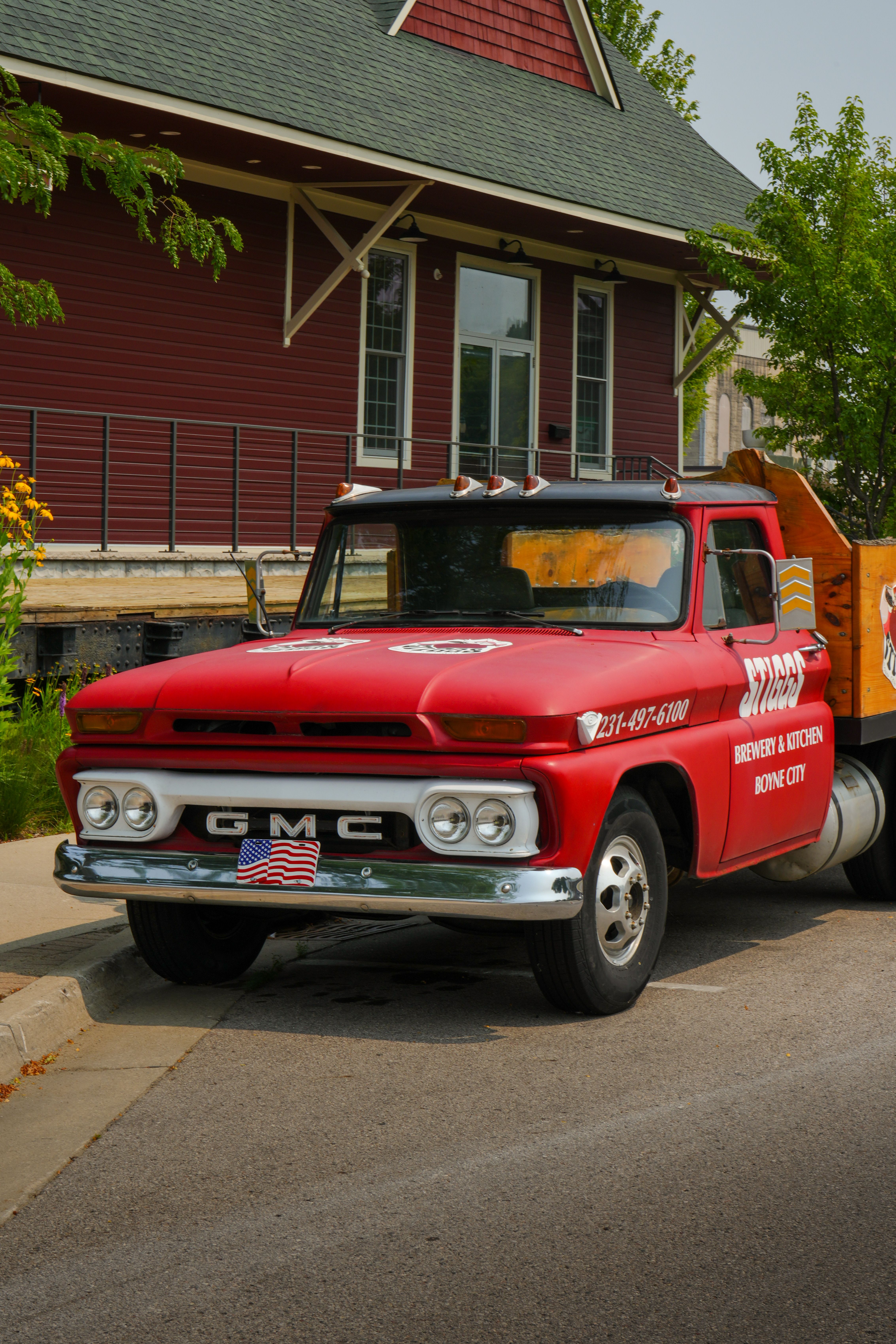 Classic Red GMC Truck Parked in Boyne City · Free Stock Photo