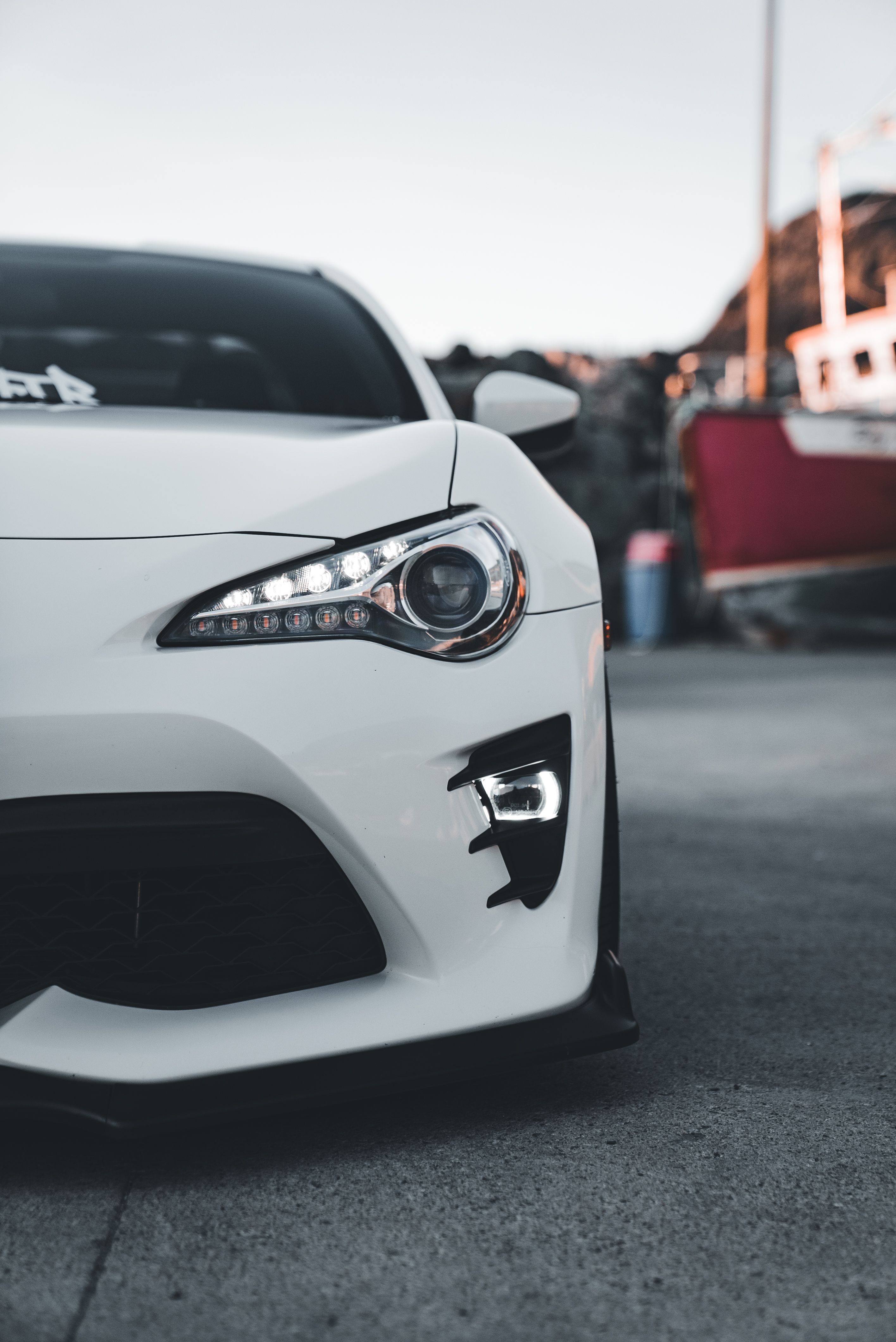 Close-Up of White Car with Bold LED Headlights · Free Stock Photo