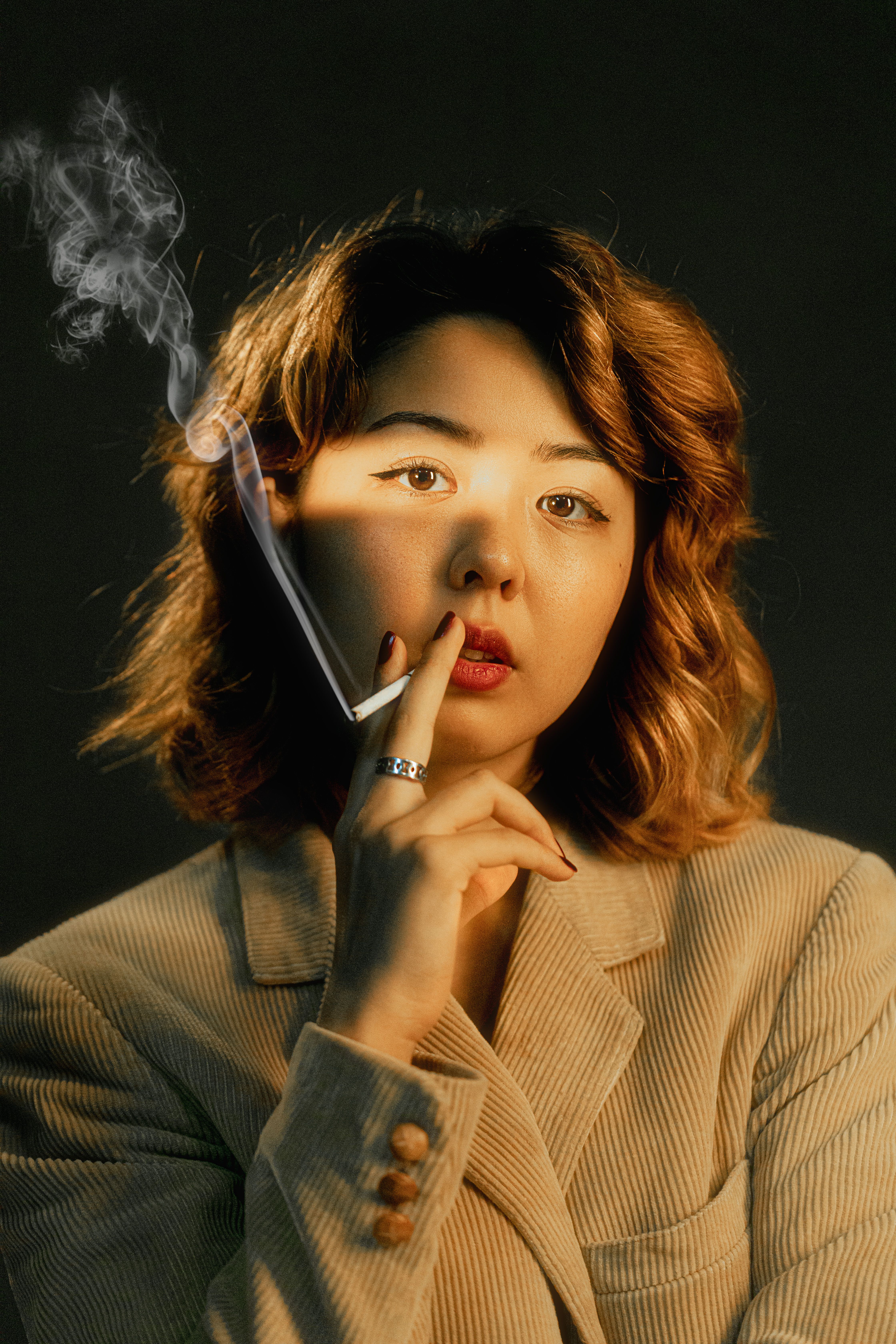 Portrait of Woman with Cigarette in Classic Lighting · Free Stock Photo