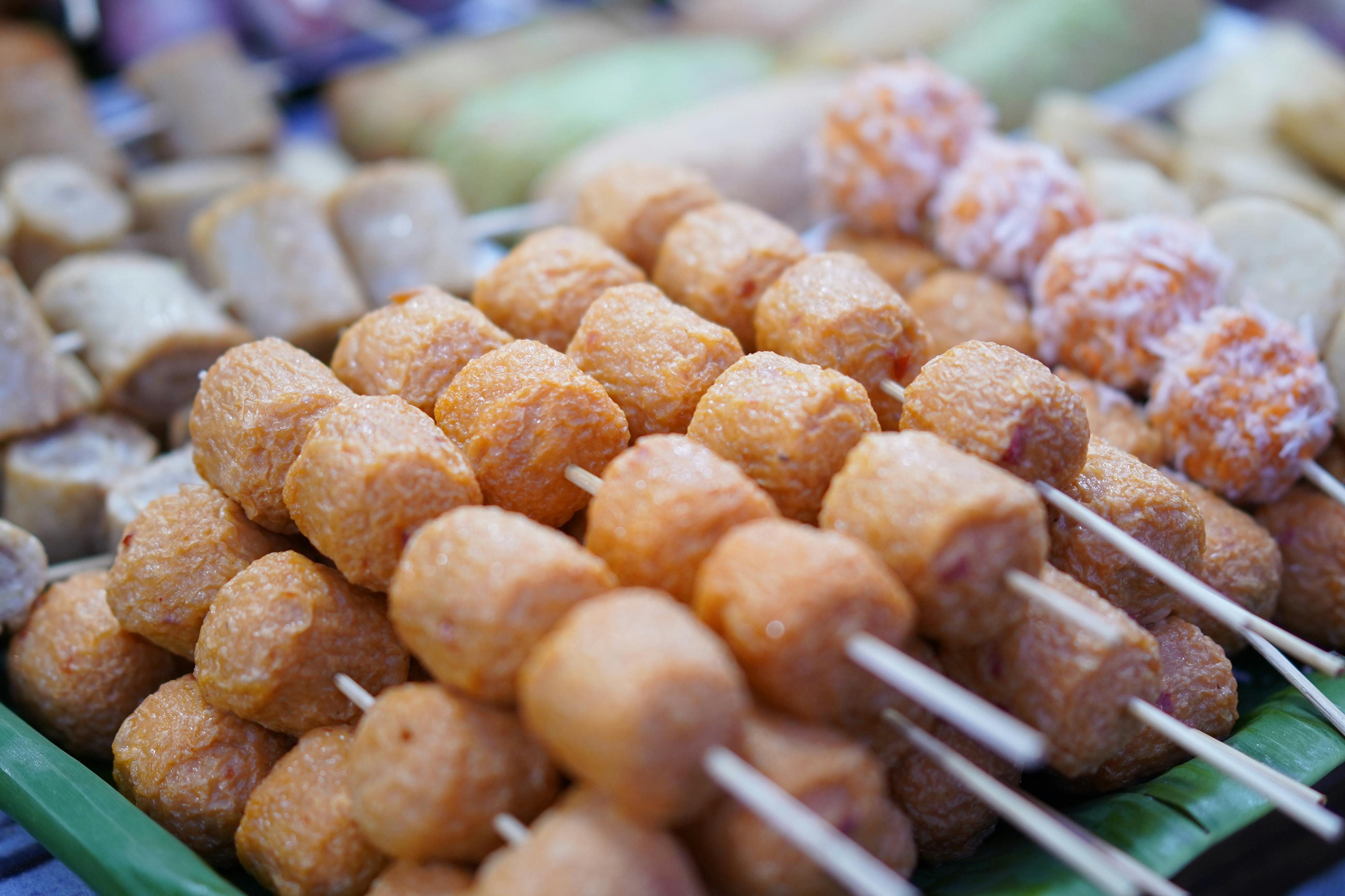 Tilt Shift Photography of Street Foods in Stick · Free Stock Photo