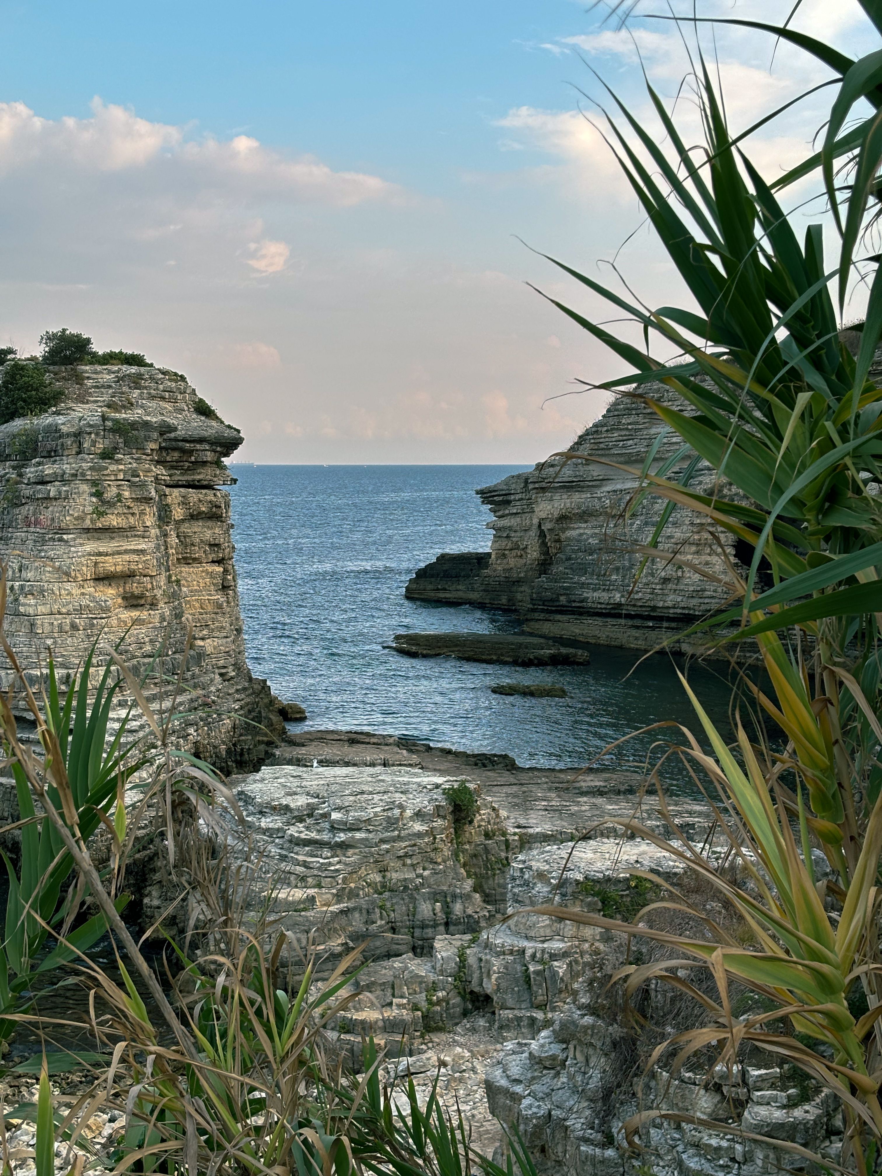 Rocky Cliffs Overlooking the Ocean at Sunset · Free Stock Photo