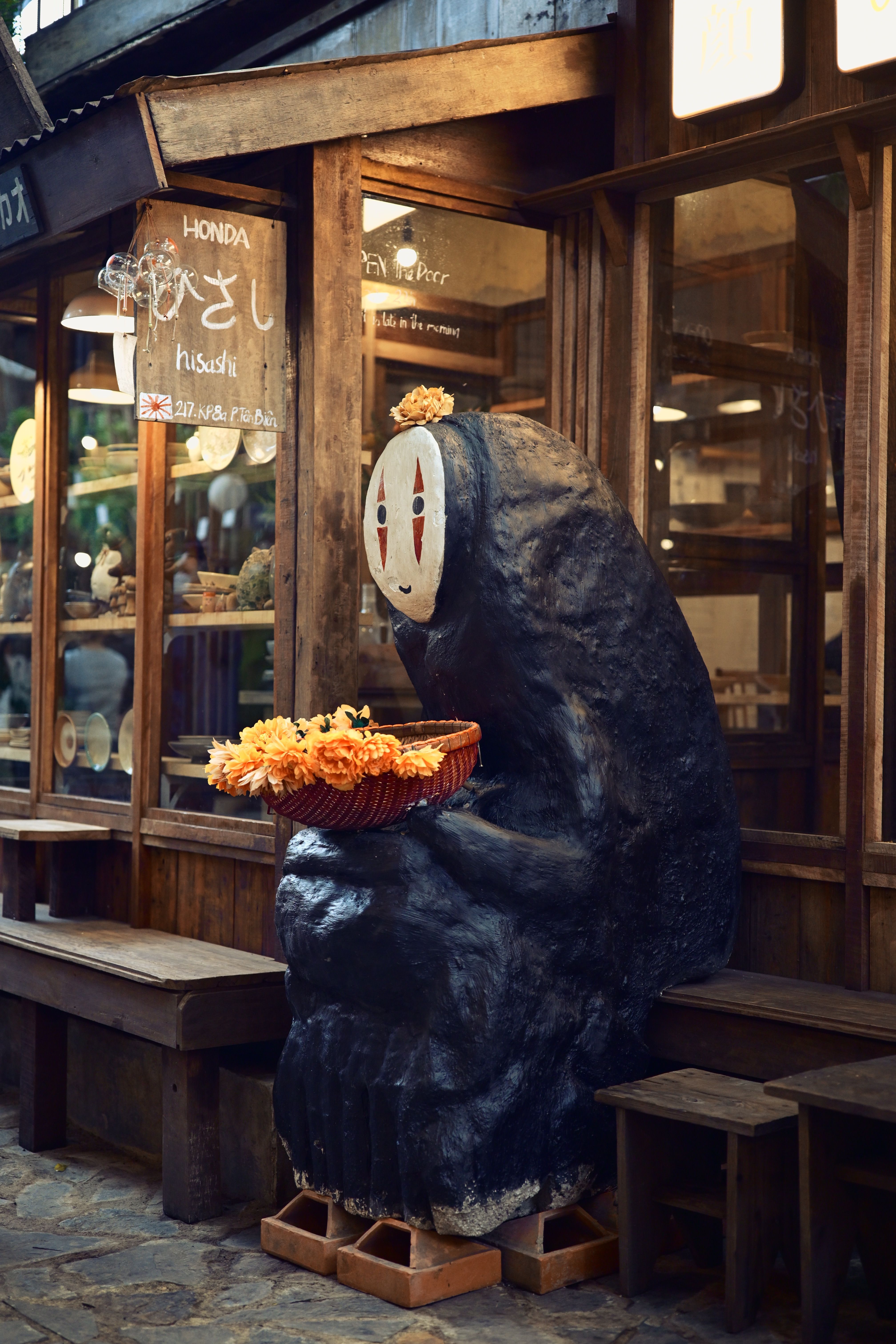 Traditional Japanese Street Scene with Unique Statue · Free Stock Photo