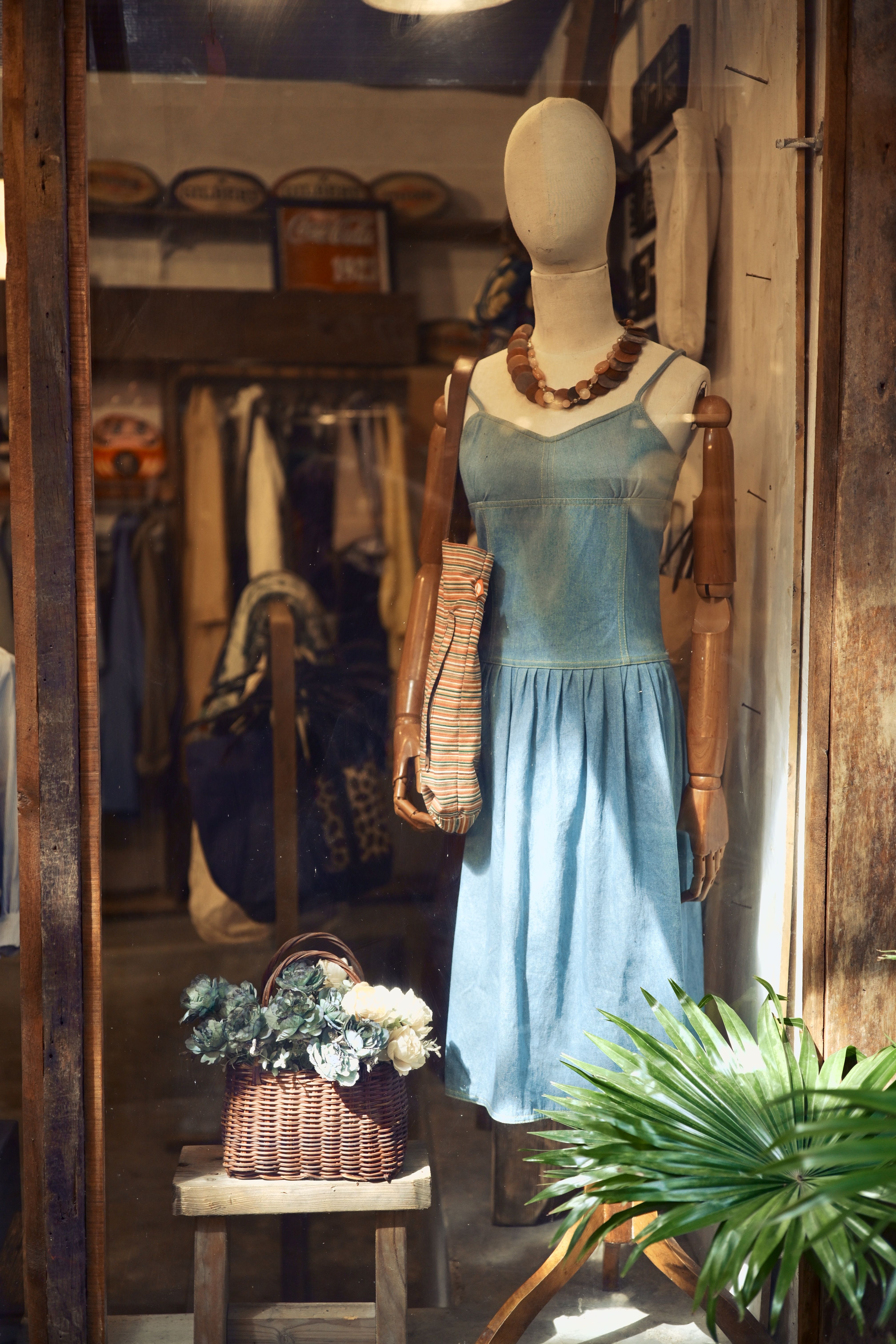 Chic Mannequin in Vintage Boutique Window Display · Free Stock Photo
